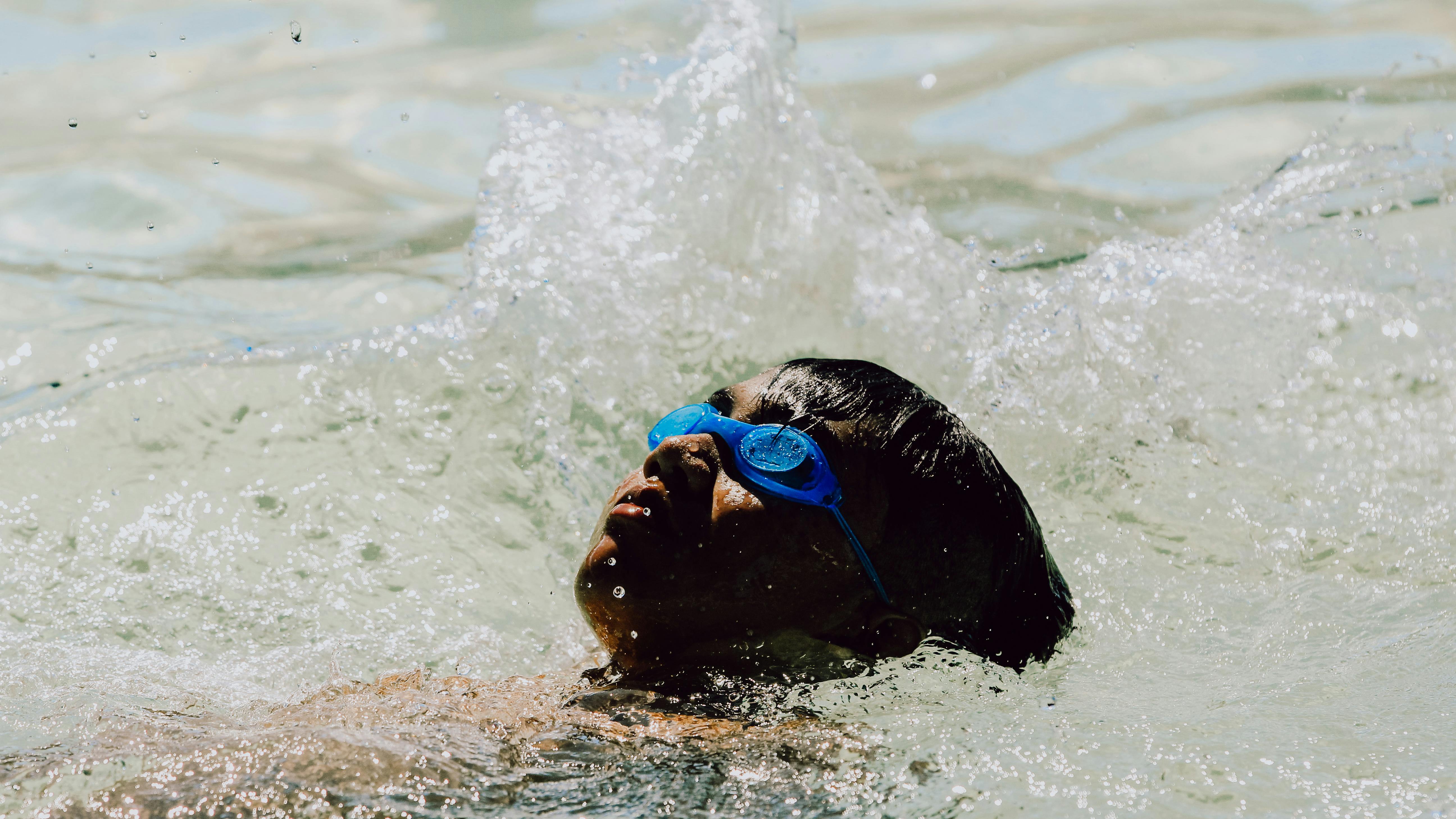Child Enjoying a Swim in East Java Pool · Free Stock Photo