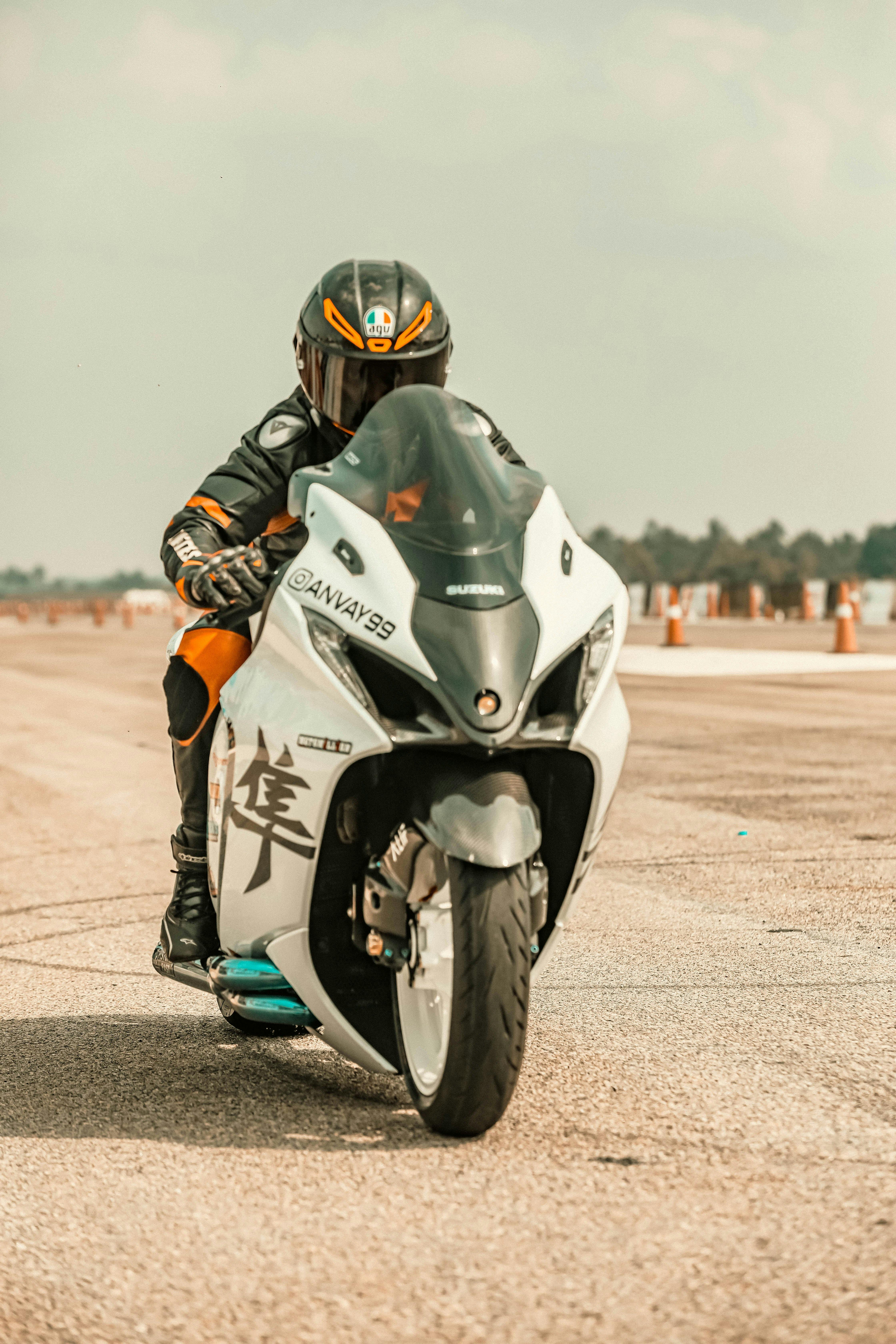 Motorcyclist Riding High-Speed Sport Bike Outdoors · Free Stock Photo