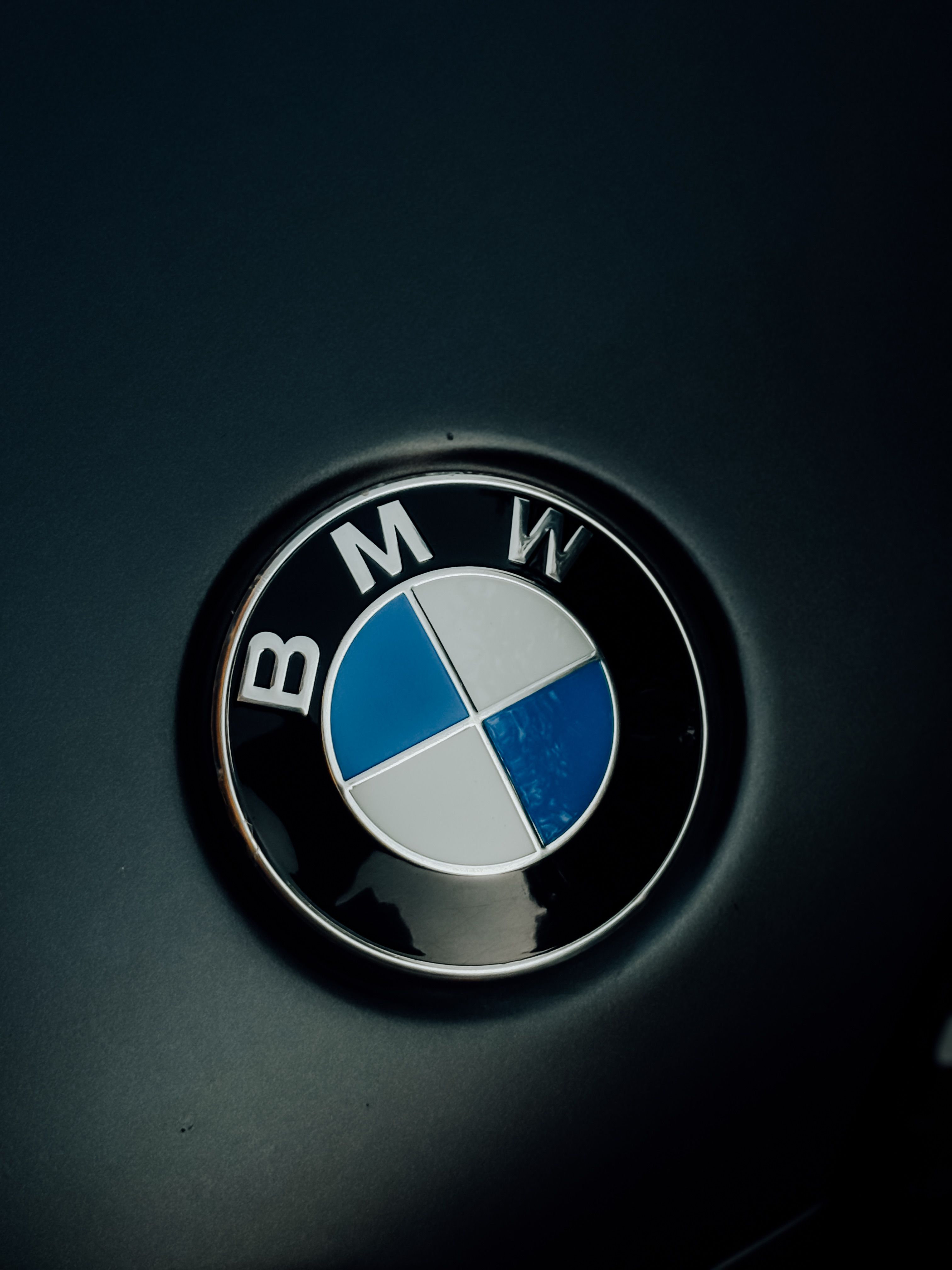 Close-up of BMW Logo on Car Hood · Free Stock Photo