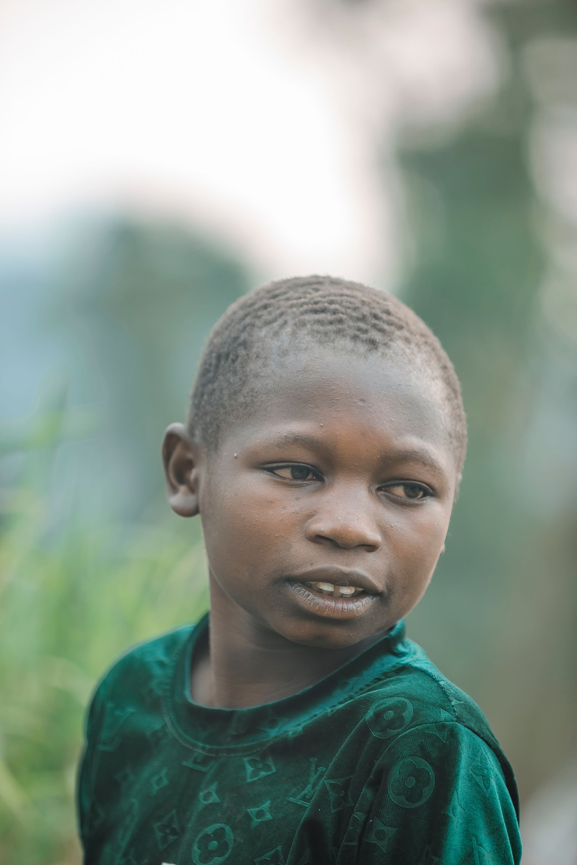 Portrait of Young Boy in Outdoor Setting · Free Stock Photo