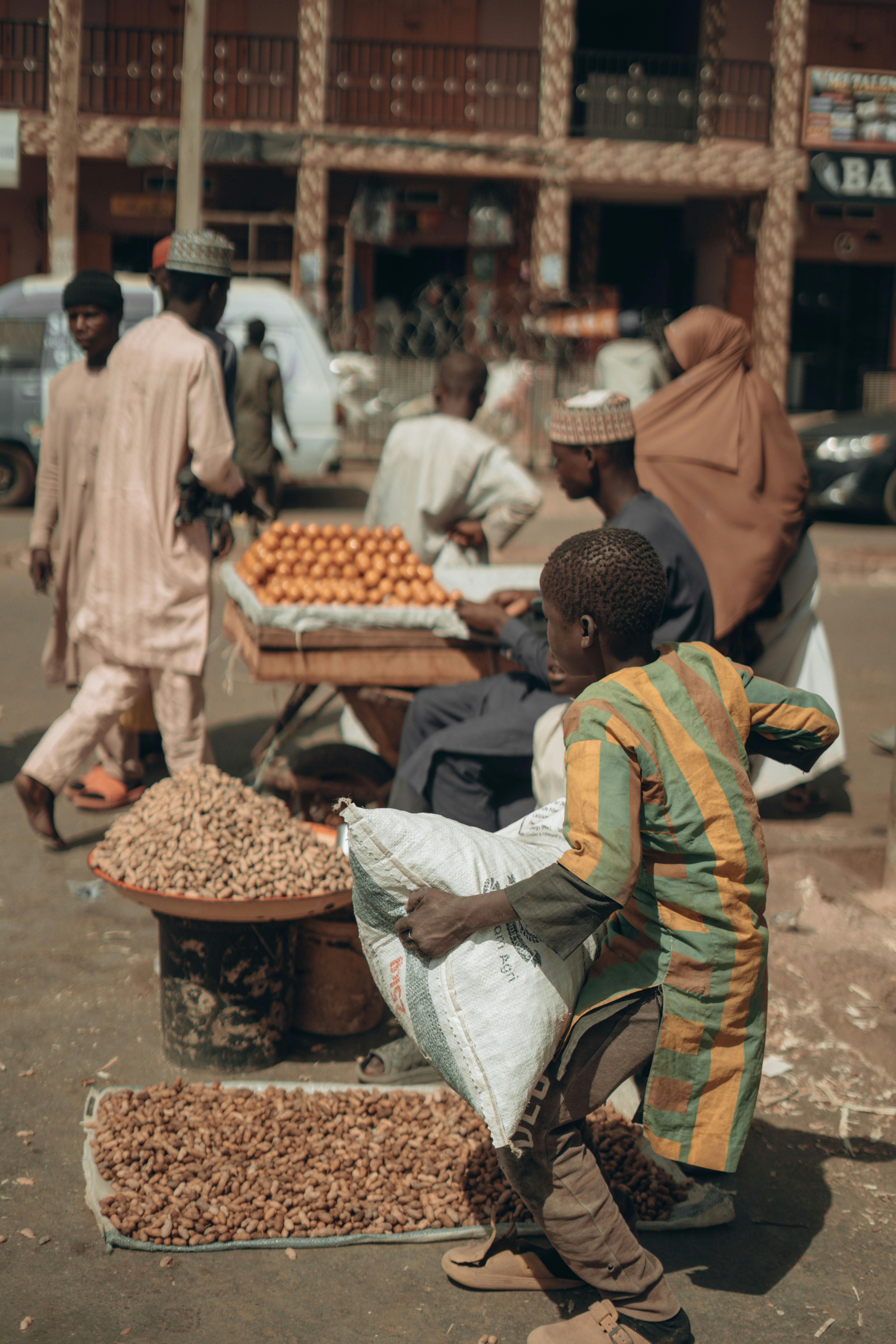 Bustling African Market Scene with Local Vendors · Free Stock Photo