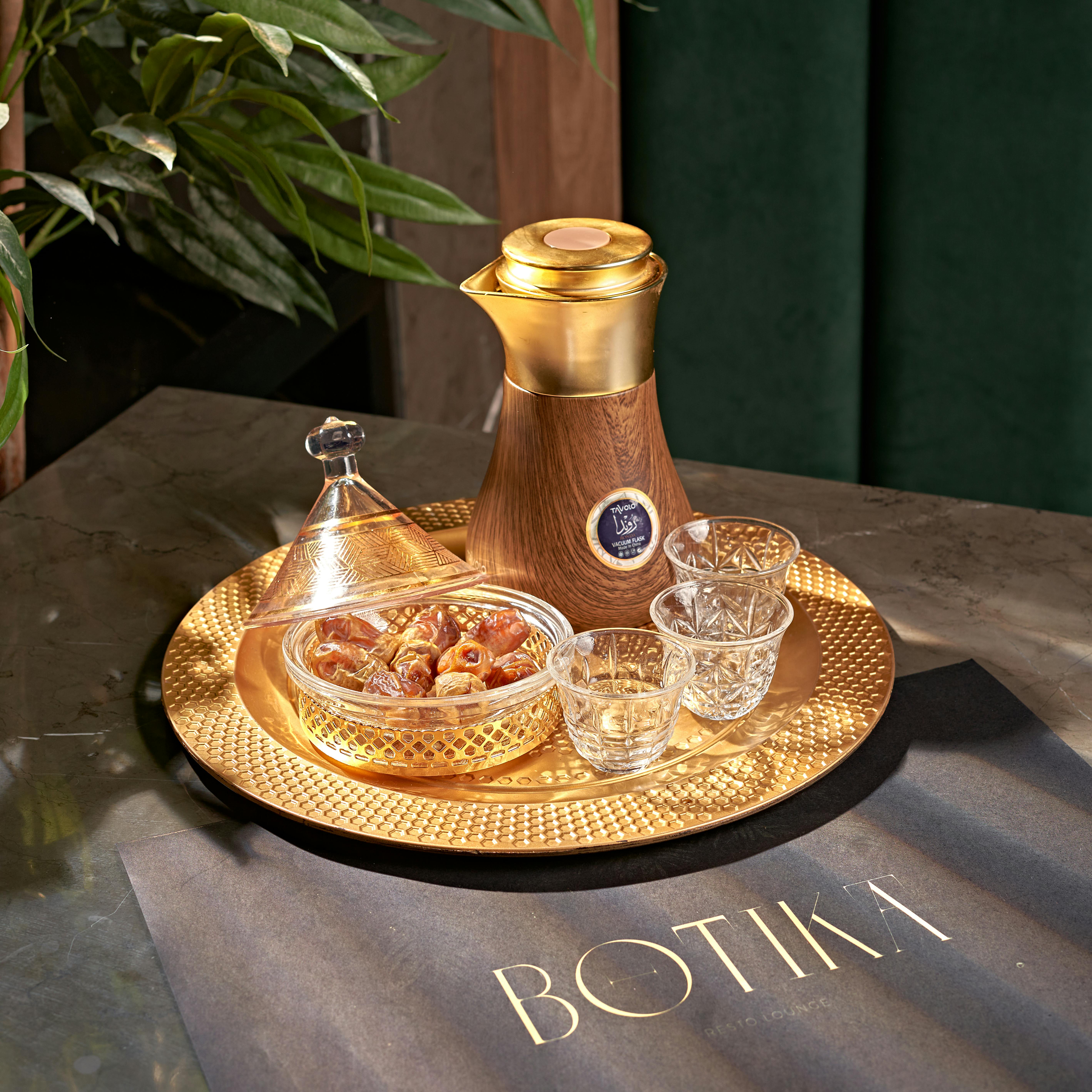 Golden Tea Set with Dates in Elegant Setting · Free Stock Photo