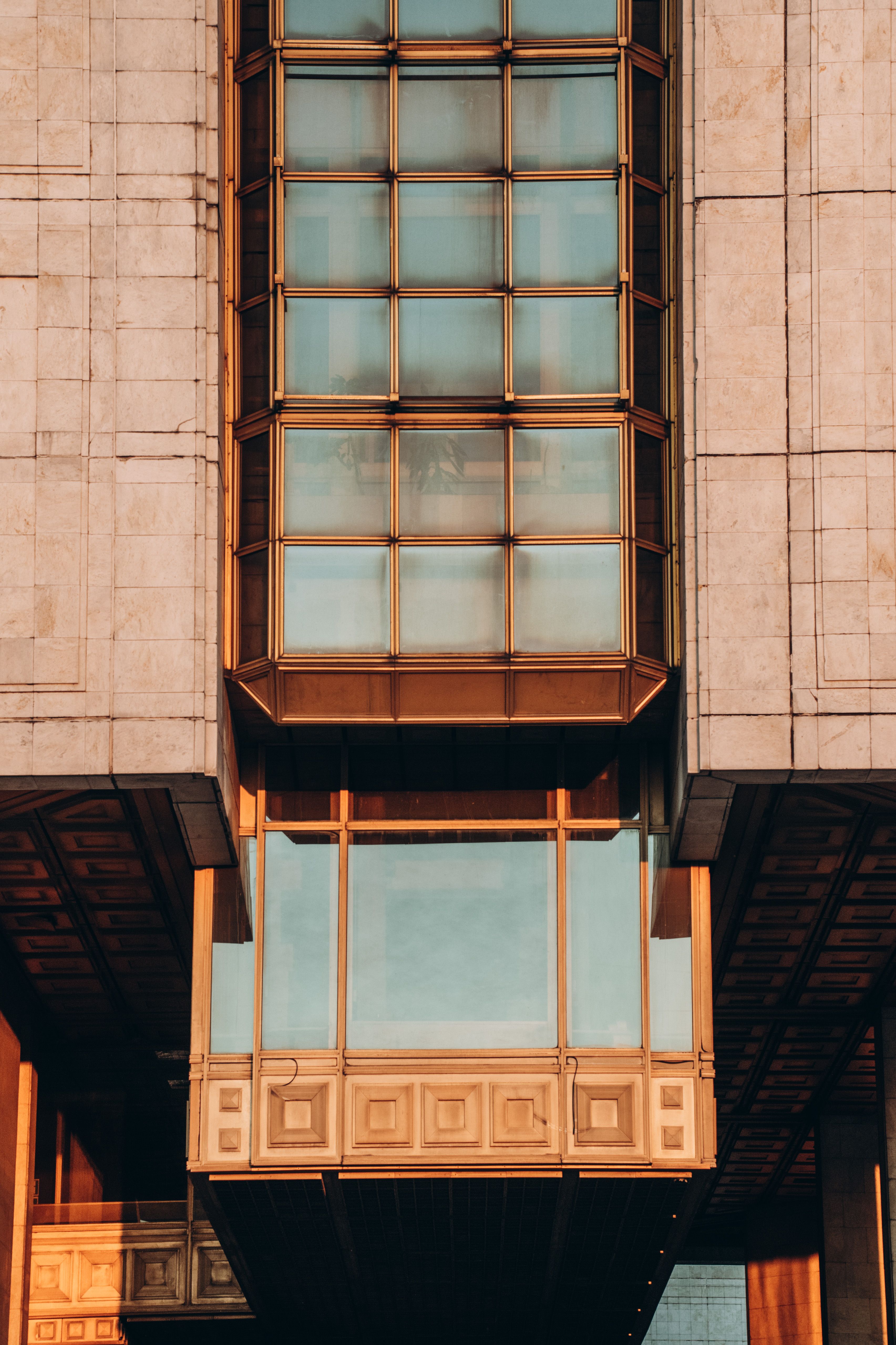 Modern Architectural Exterior with Glass Windows · Free Stock Photo
