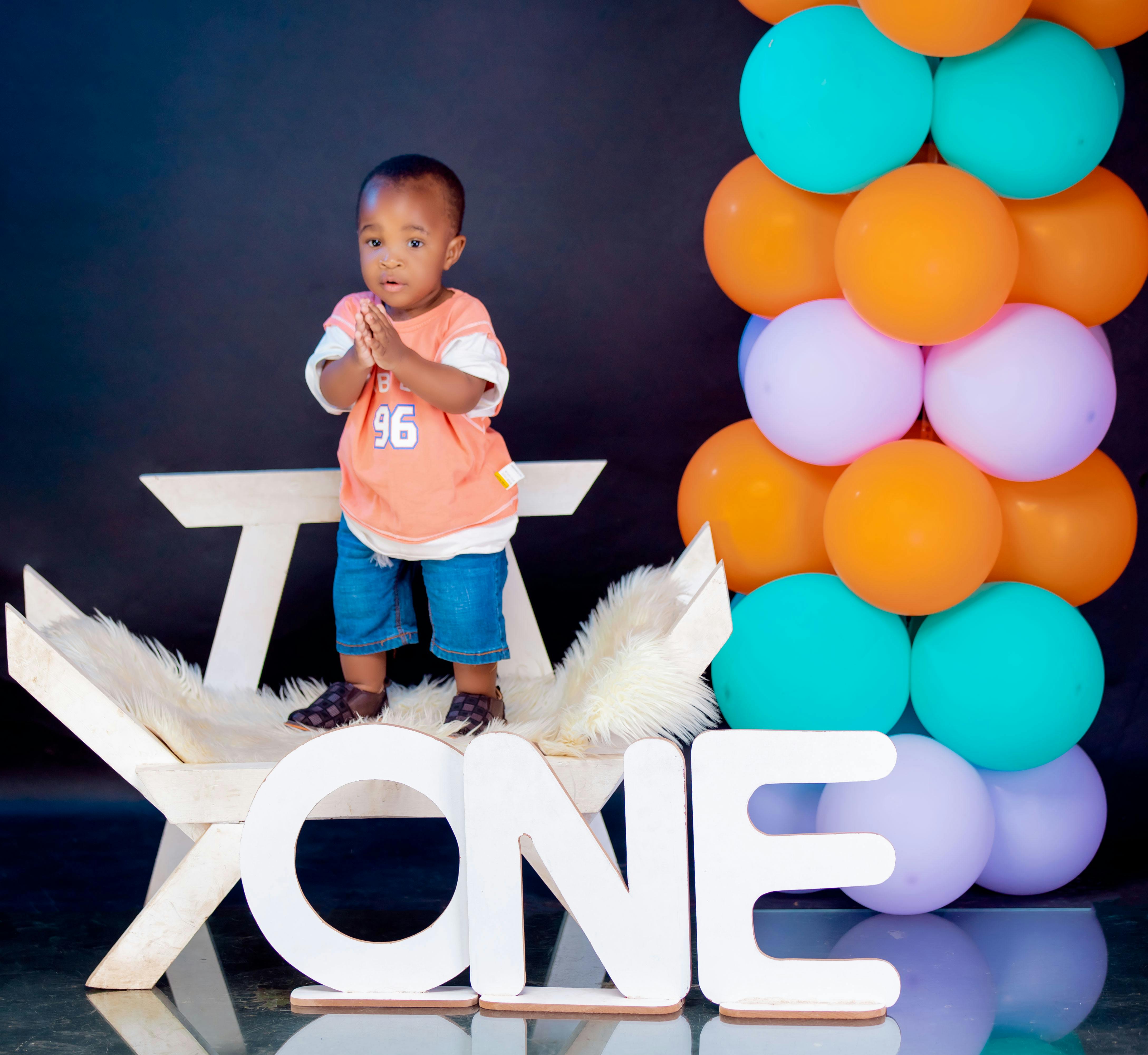 Colorful First Birthday Celebration Portrait · Free Stock Photo