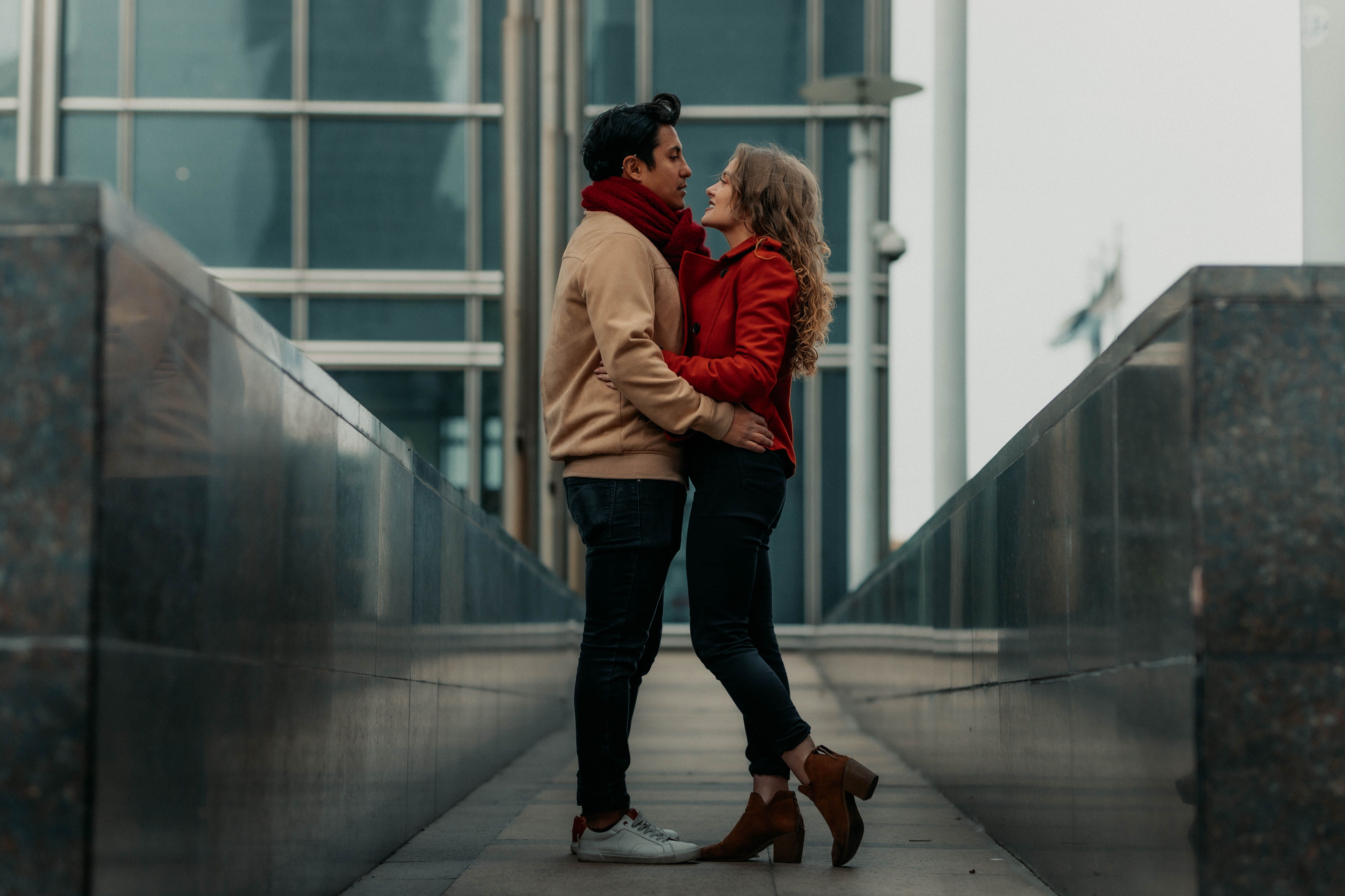 Romantic Couple Embracing in Urban Setting · Free Stock Photo