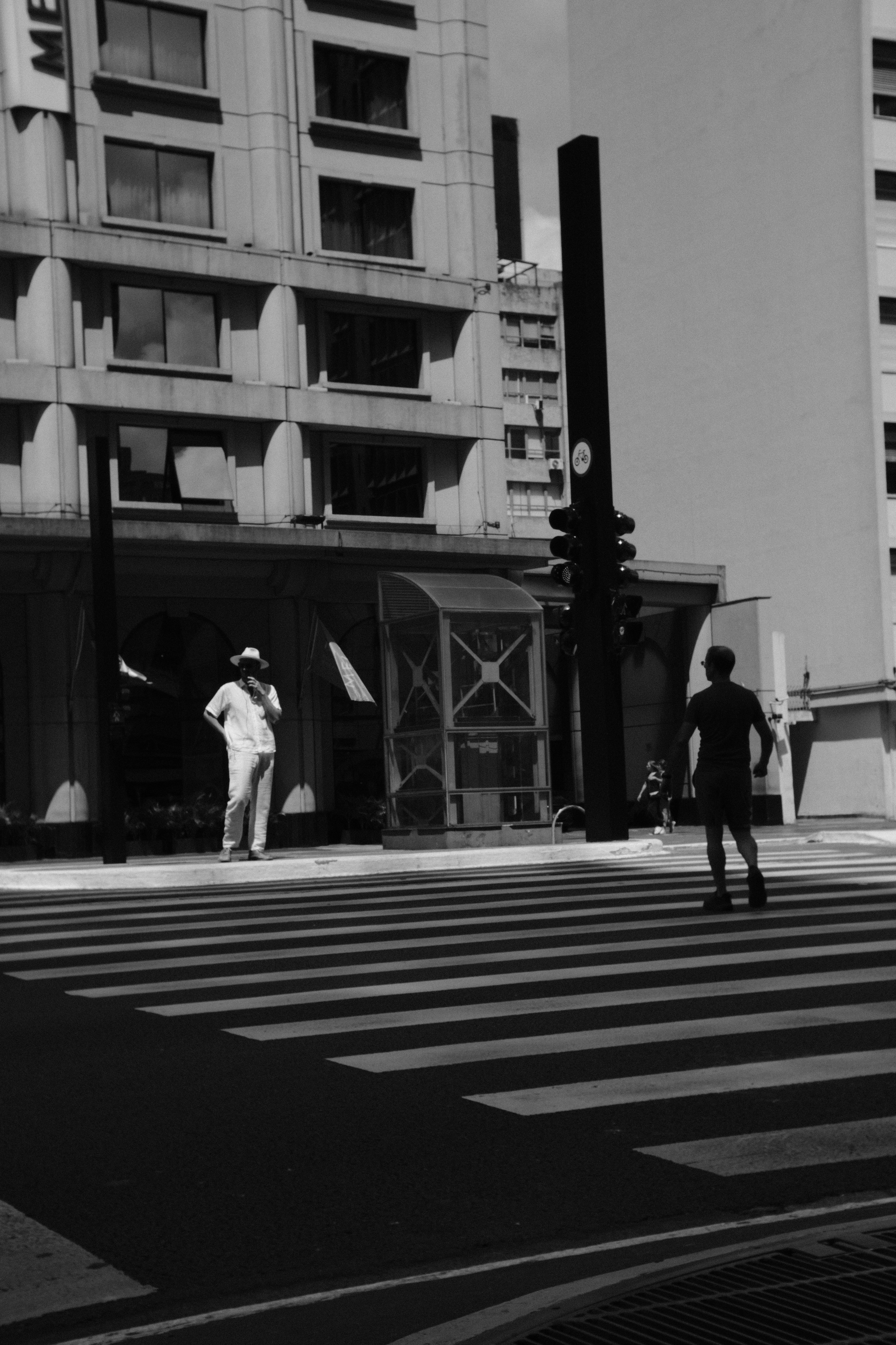 Black and White Urban Streetscape with Pedestrians · Free Stock Photo