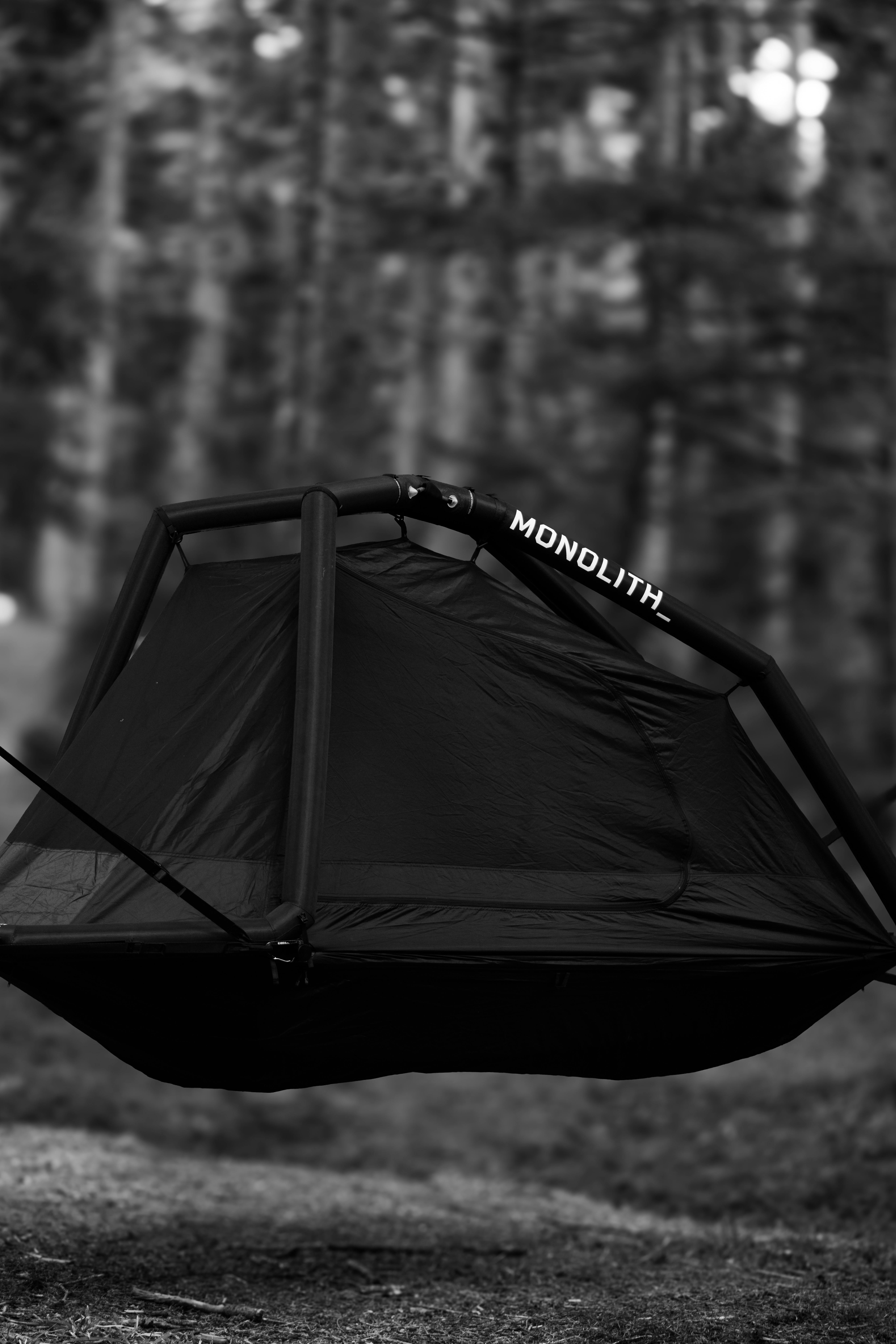 Black Monolith Tent Suspended in Forest · Free Stock Photo