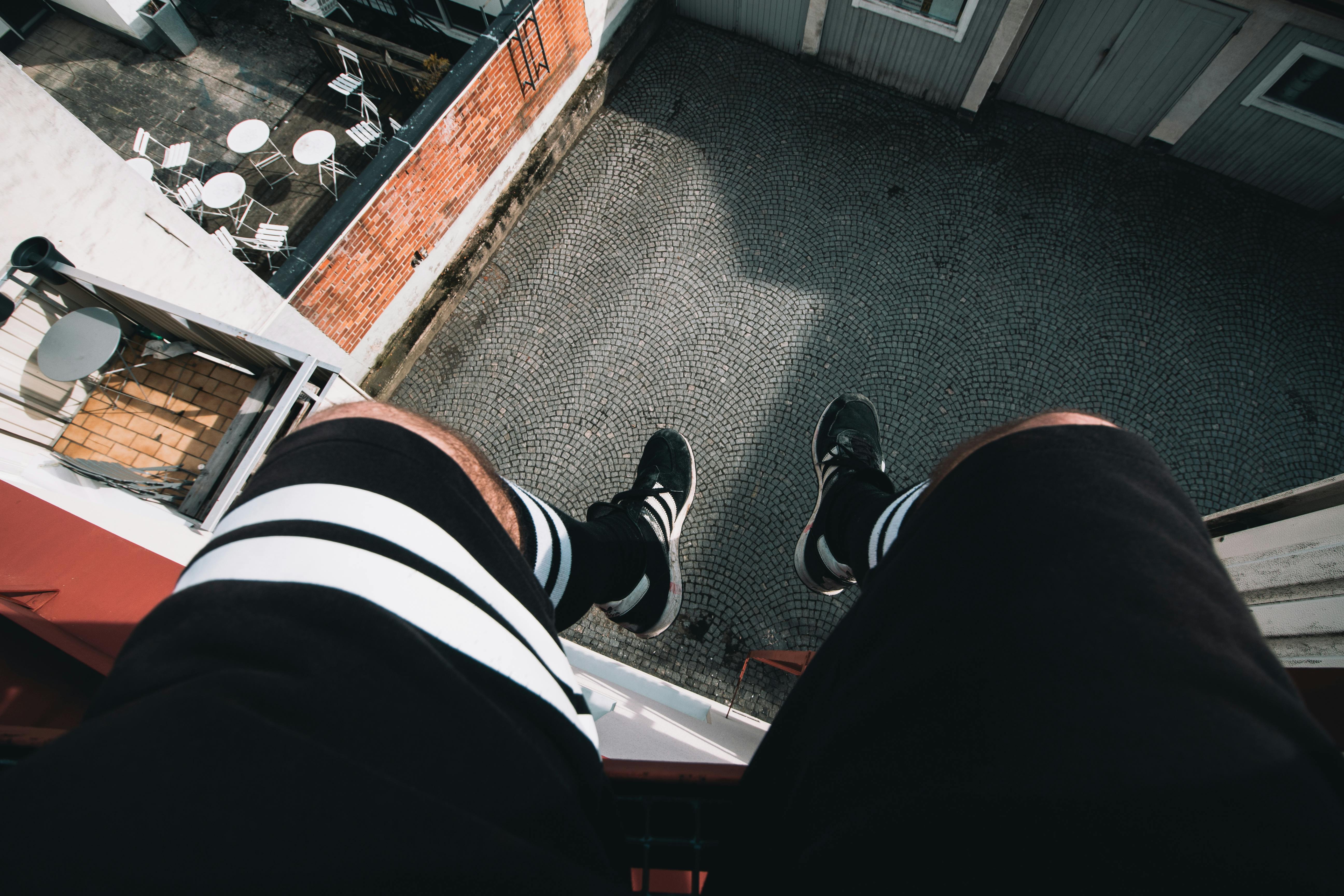 Person Sitting On A Rooftop · Free Stock Photo