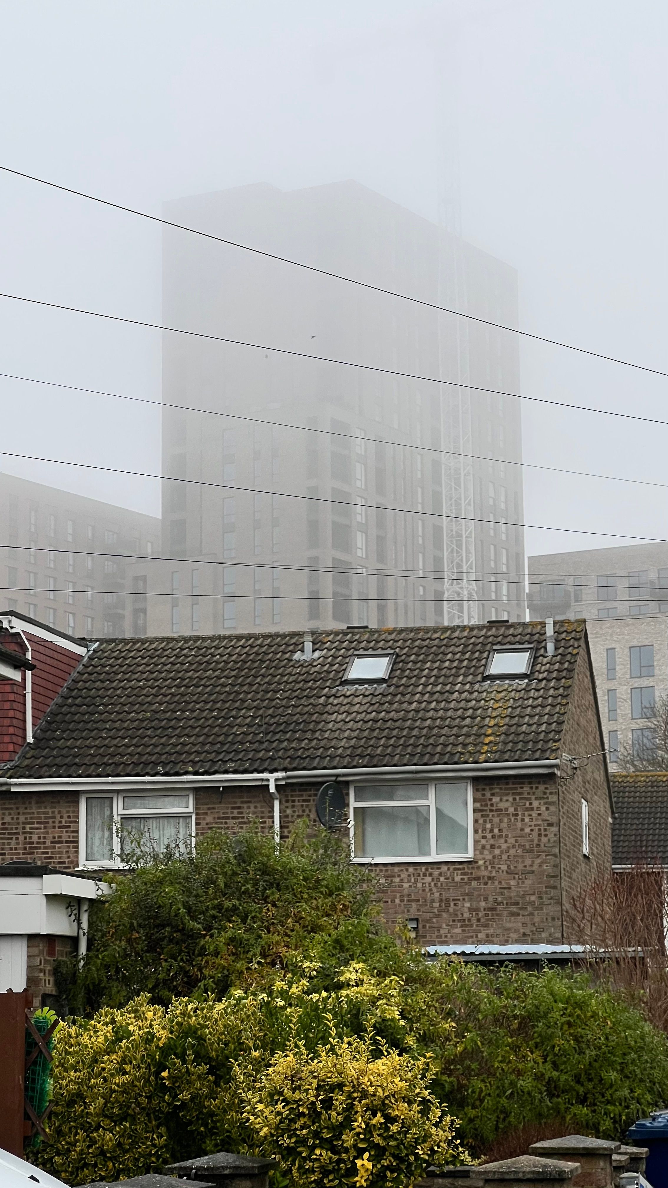Foggy Urban Landscape with High-Rise and House · Free Stock Photo