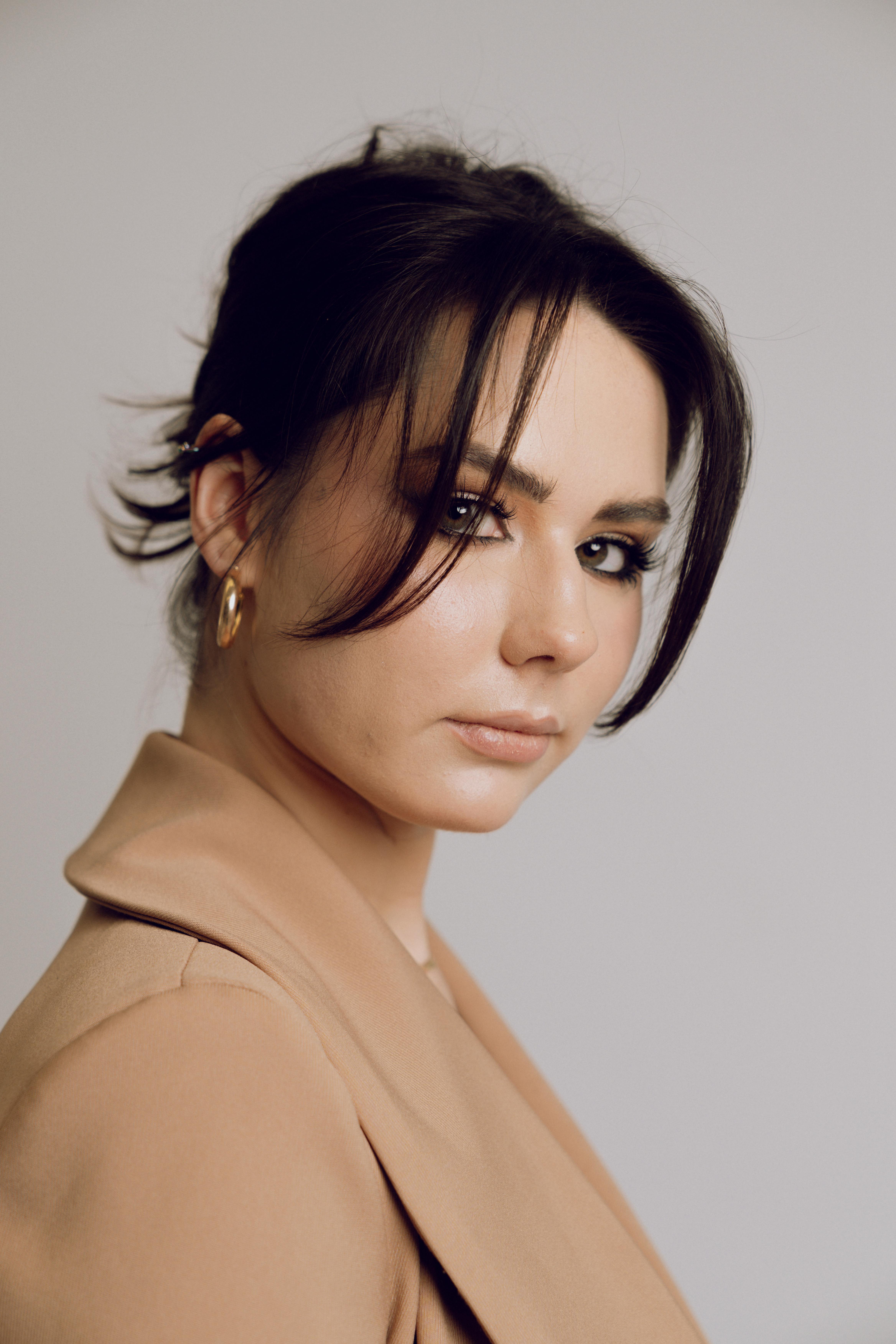 Elegant Female Portrait with Neutral Background · Free Stock Photo
