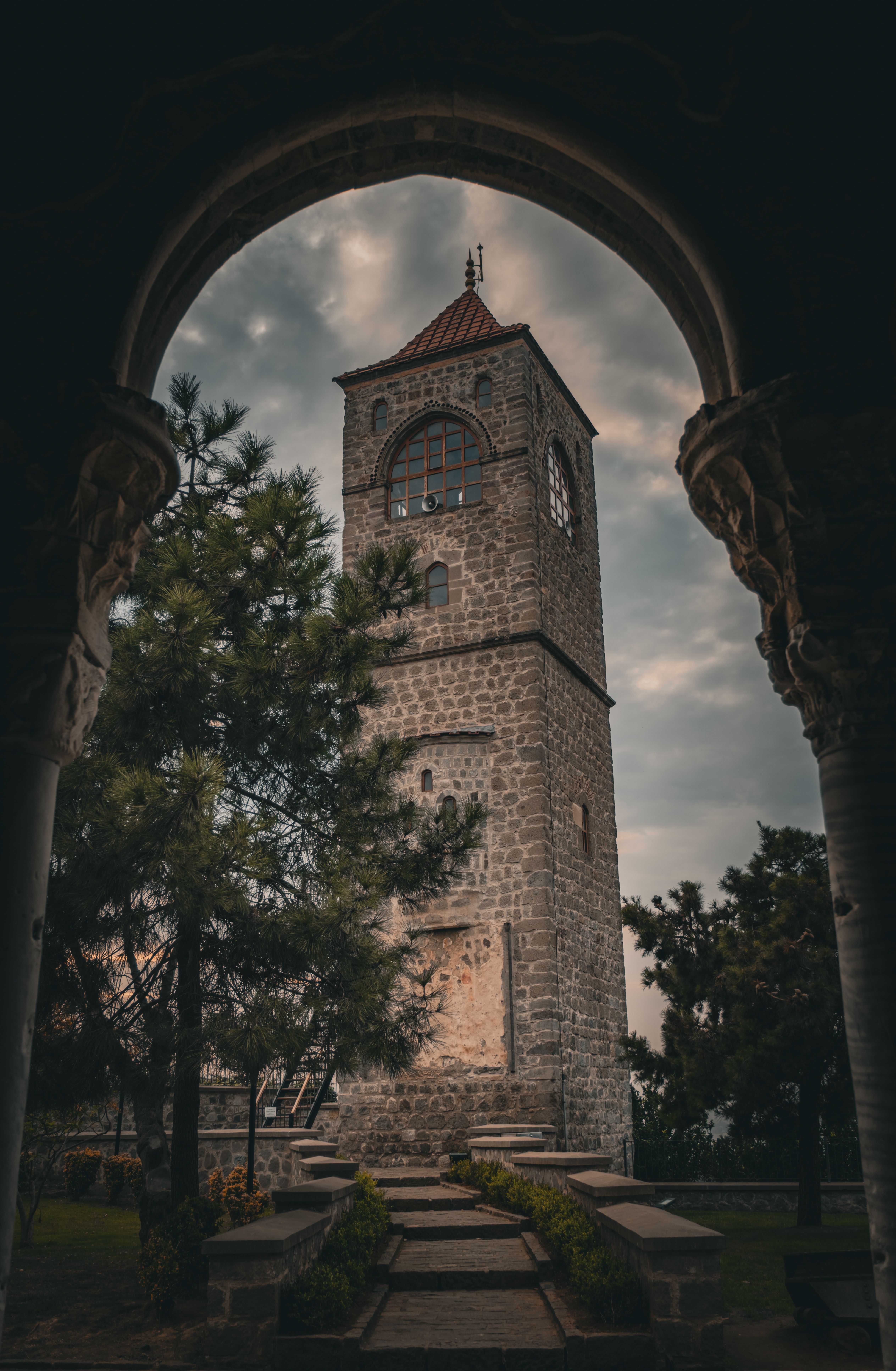 Historic Stone Tower Framed by Archway · Free Stock Photo