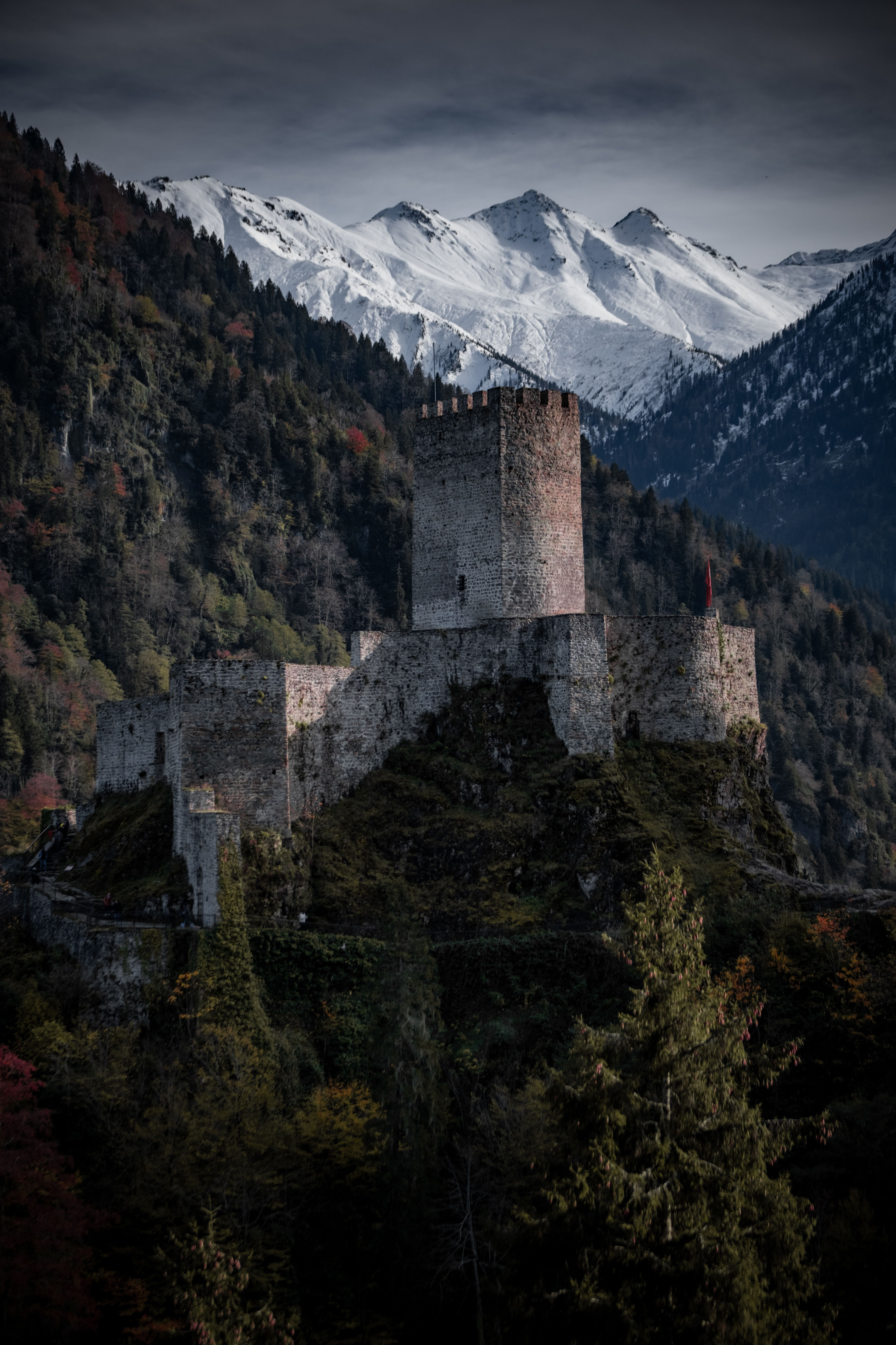 Medieval Castle with Snowy Mountain Backdrop · Free Stock Photo