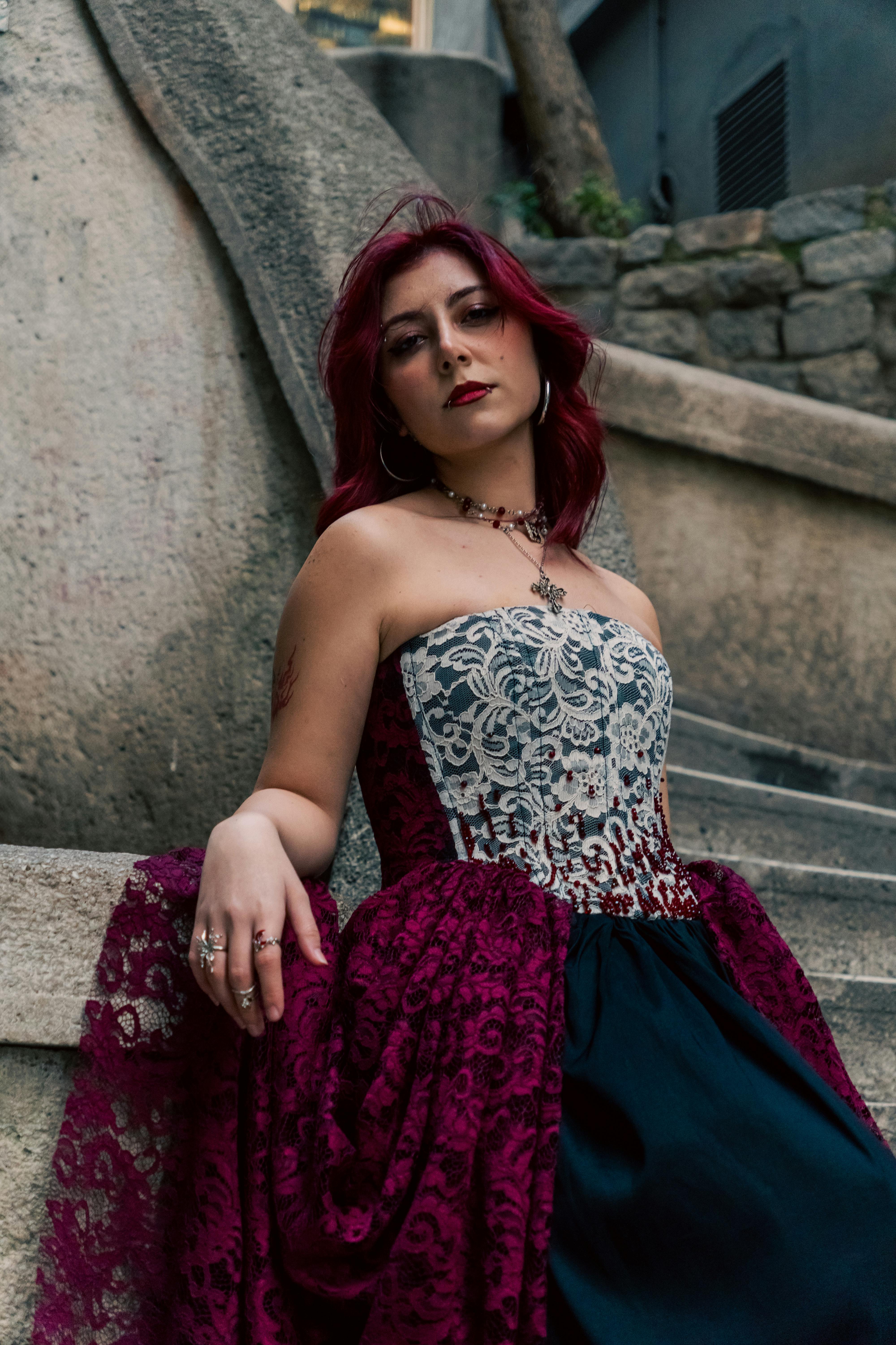 Elegant Woman in Red Lace Gown Outdoors · Free Stock Photo