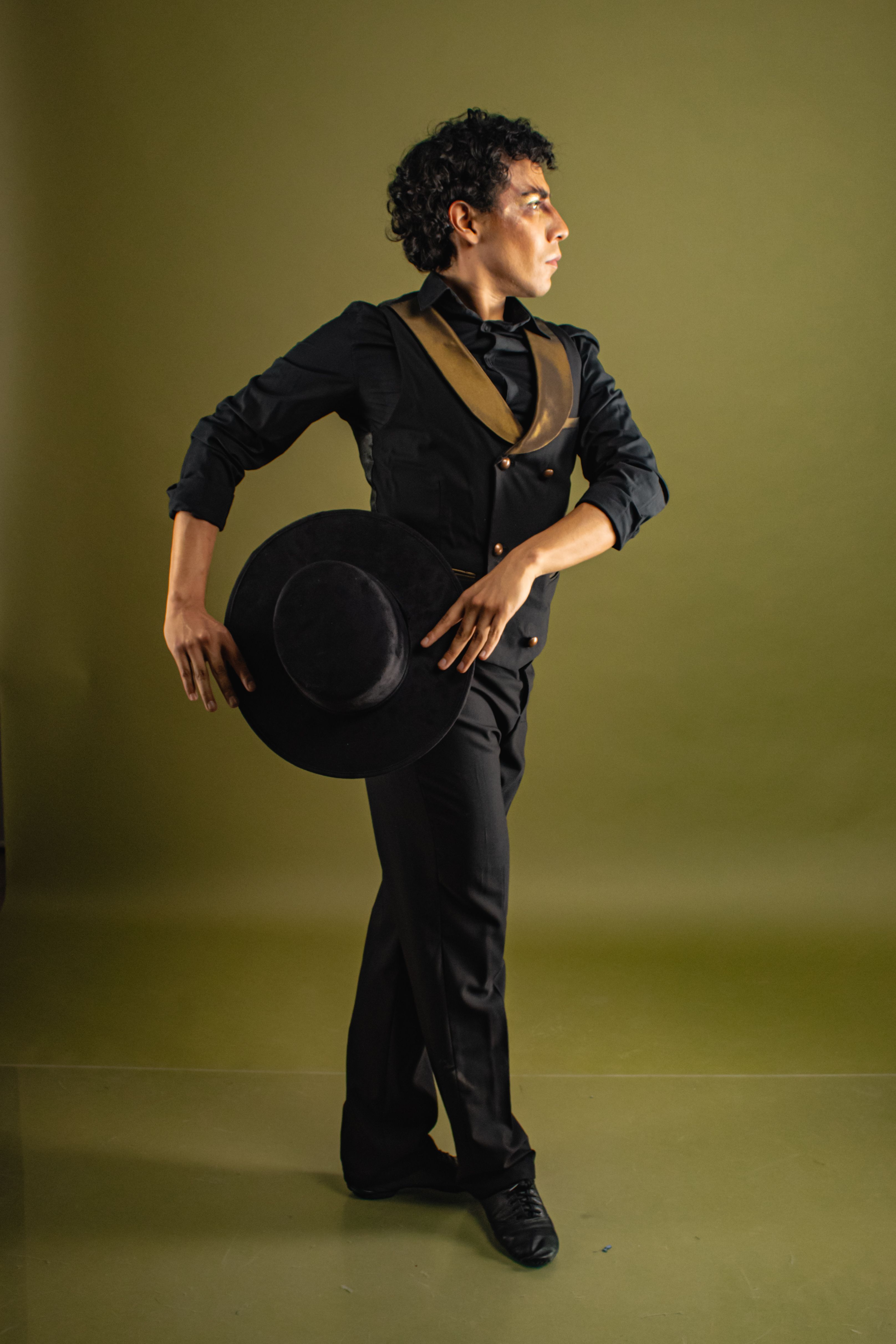 Elegant Flamenco Dancer in Black Suit with Hat · Free Stock Photo