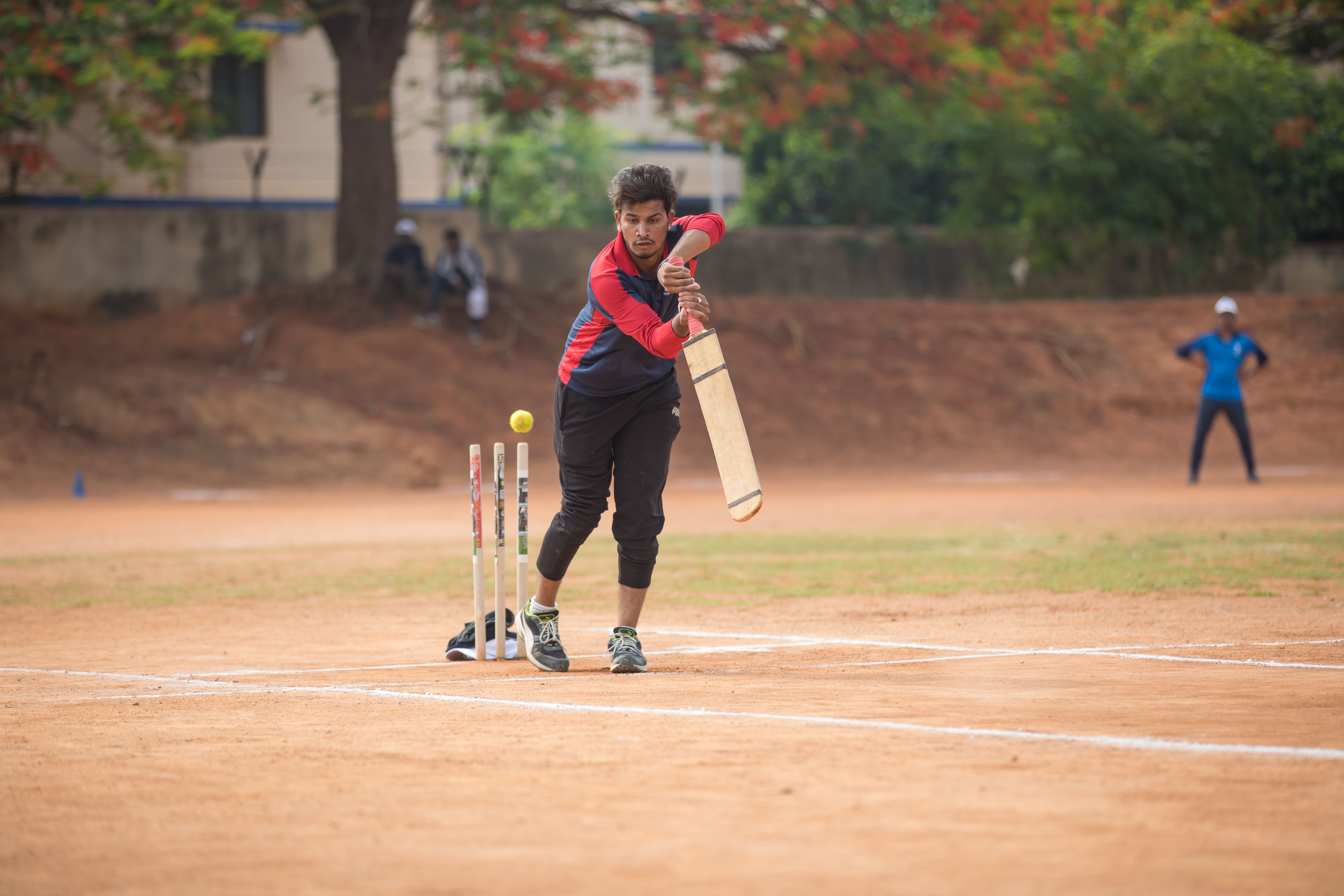 Young Cricketer Batting on Outdoor Field · Free Stock Photo