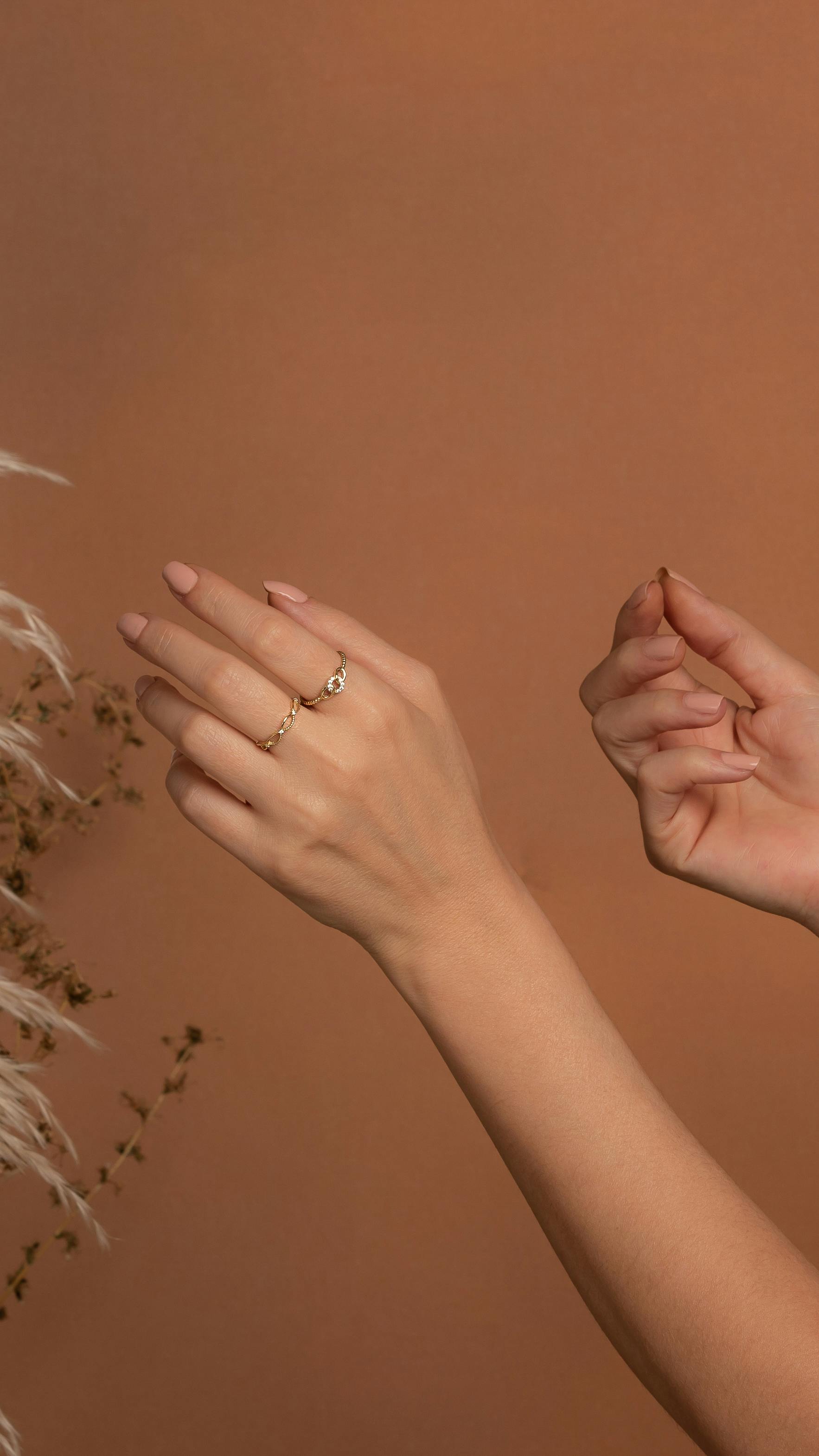 Elegant Hand Modeling Minimalist Gold Rings · Free Stock Photo