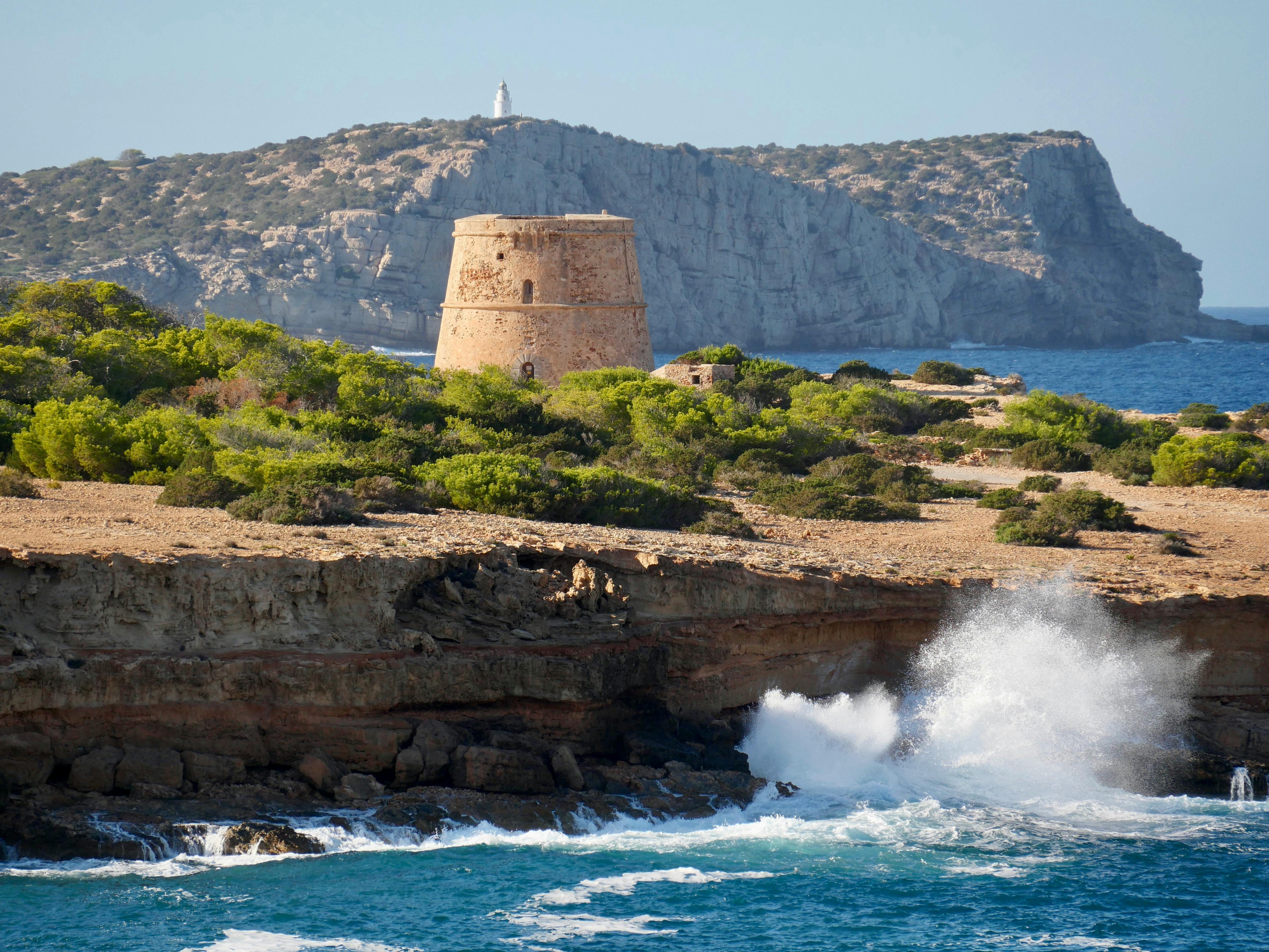 Scenic Ibiza Coastline with Torre Des Savinar · Free Stock Photo
