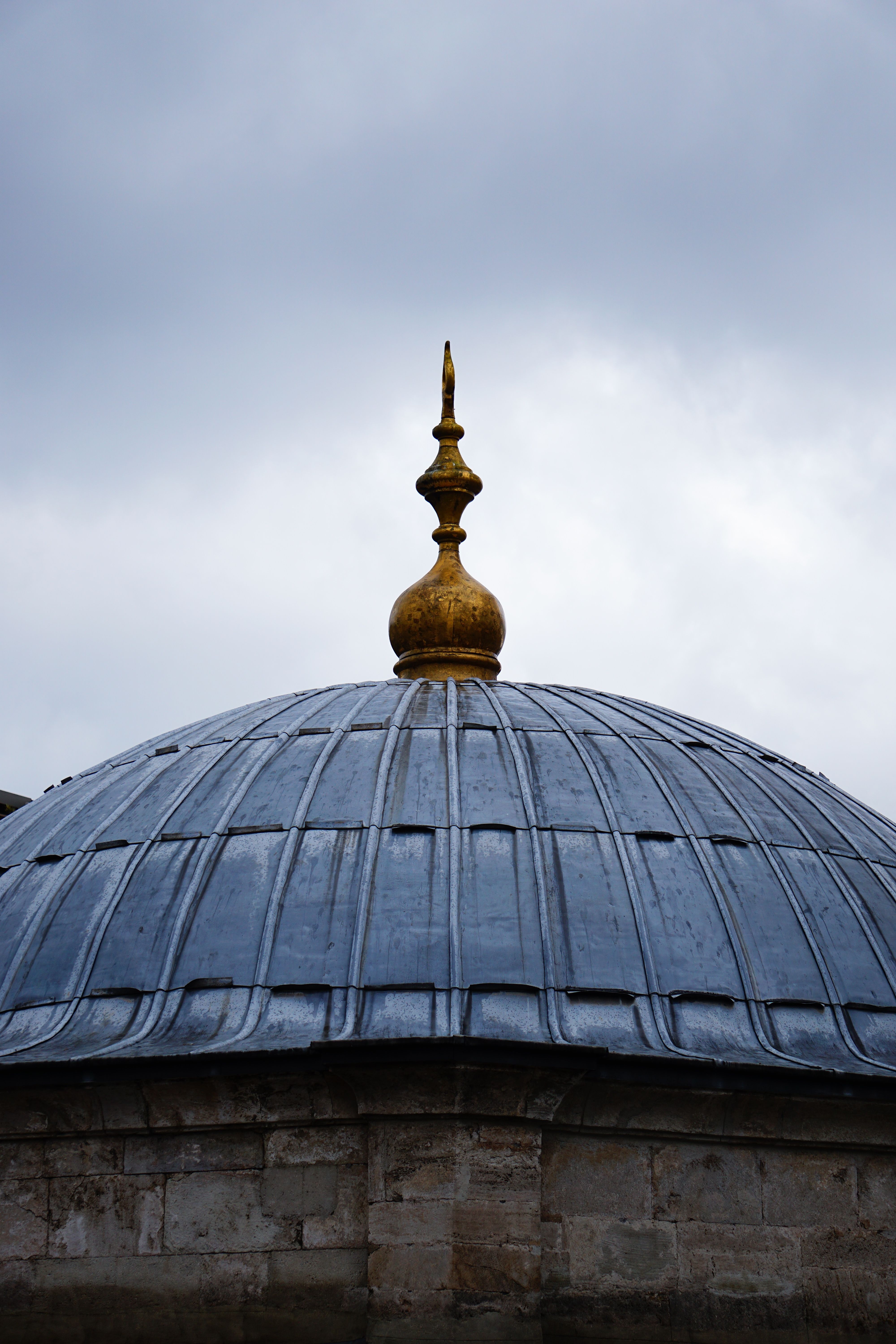 Intricate Dome Design with Golden Finial Against Cloudy Sky · Free ...