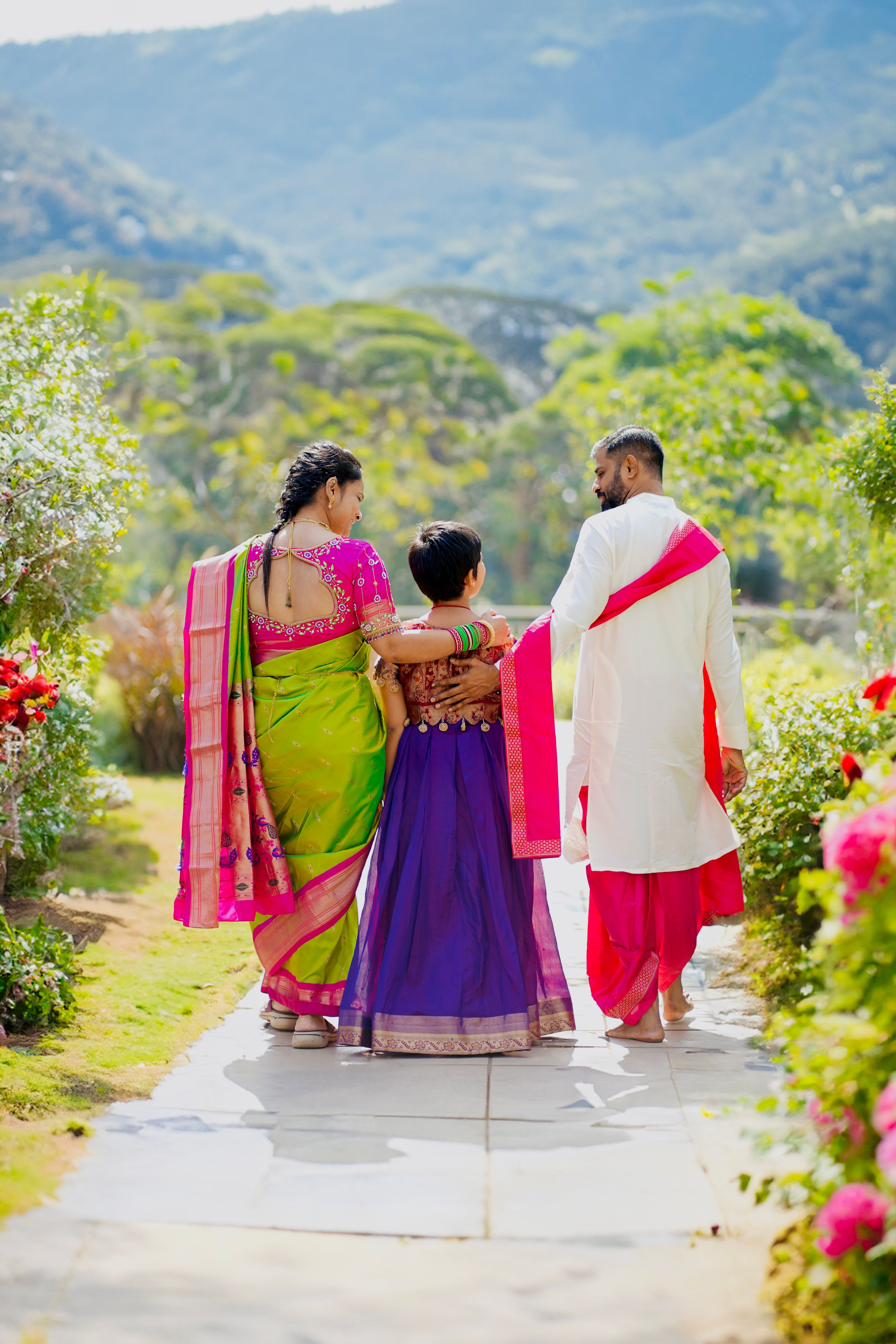South Asian Family in Traditional Attire Outdoors · Free Stock Photo