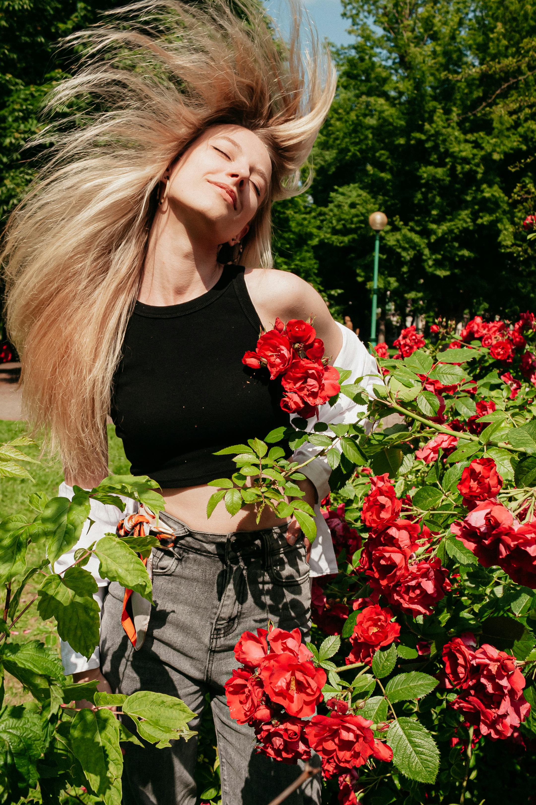 Woman Enjoying Nature in Rose Garden · Free Stock Photo