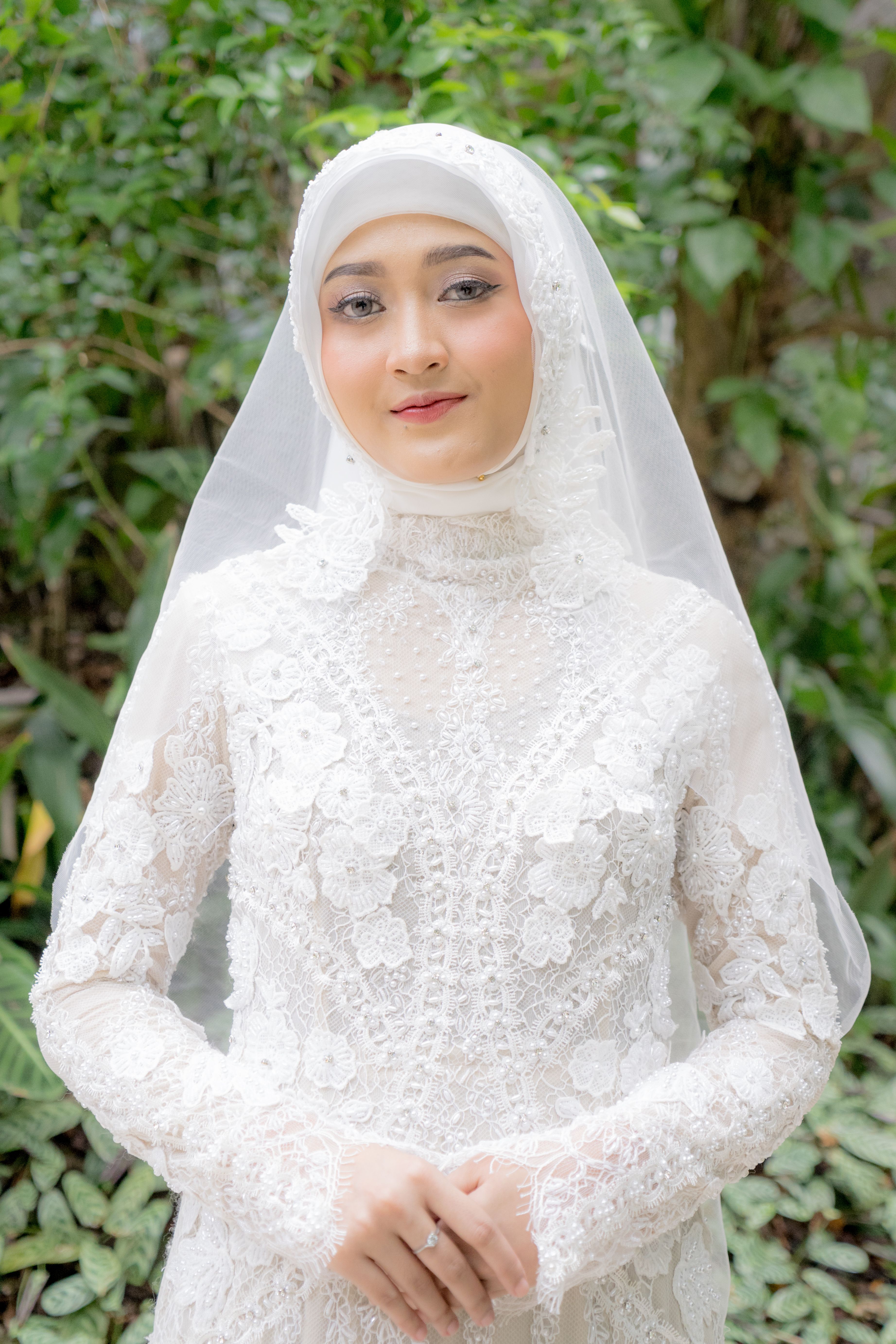 Elegant Muslim Bride in White Lace Dress Outdoors · Free Stock Photo