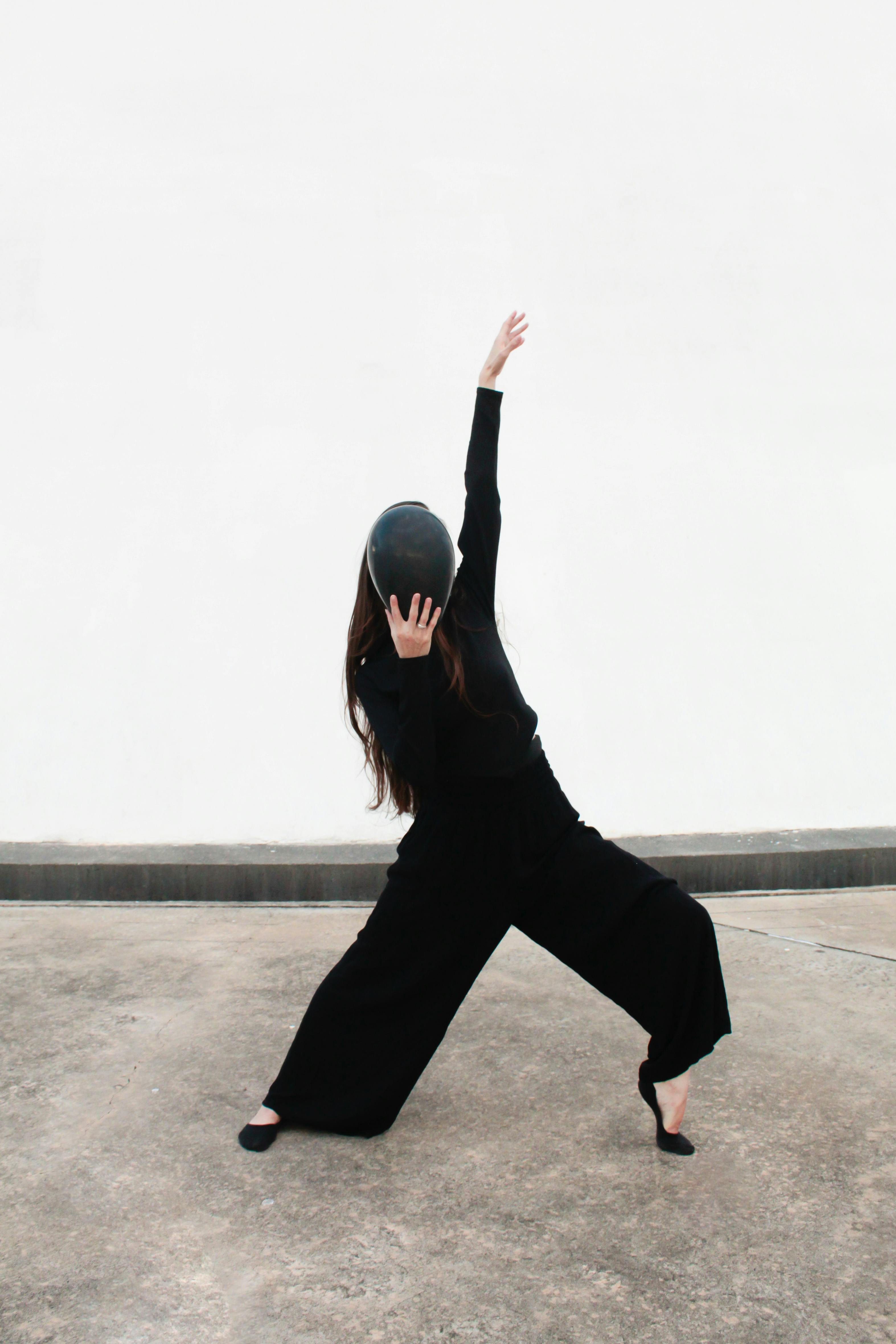 Modern Dance Pose Against Minimalist Background · Free Stock Photo