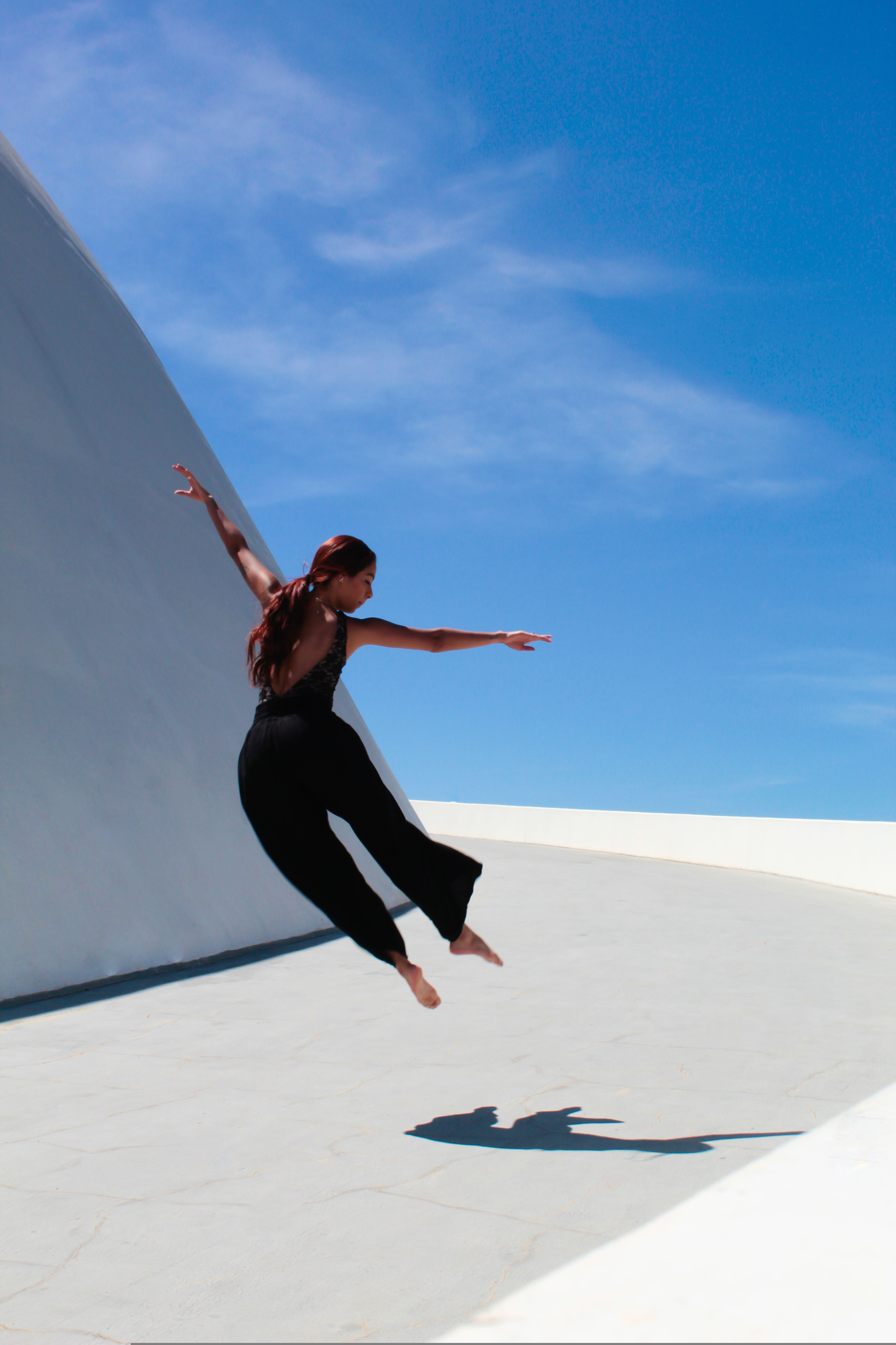 Dynamic Dance Movement Against Modern Architecture · Free Stock Photo