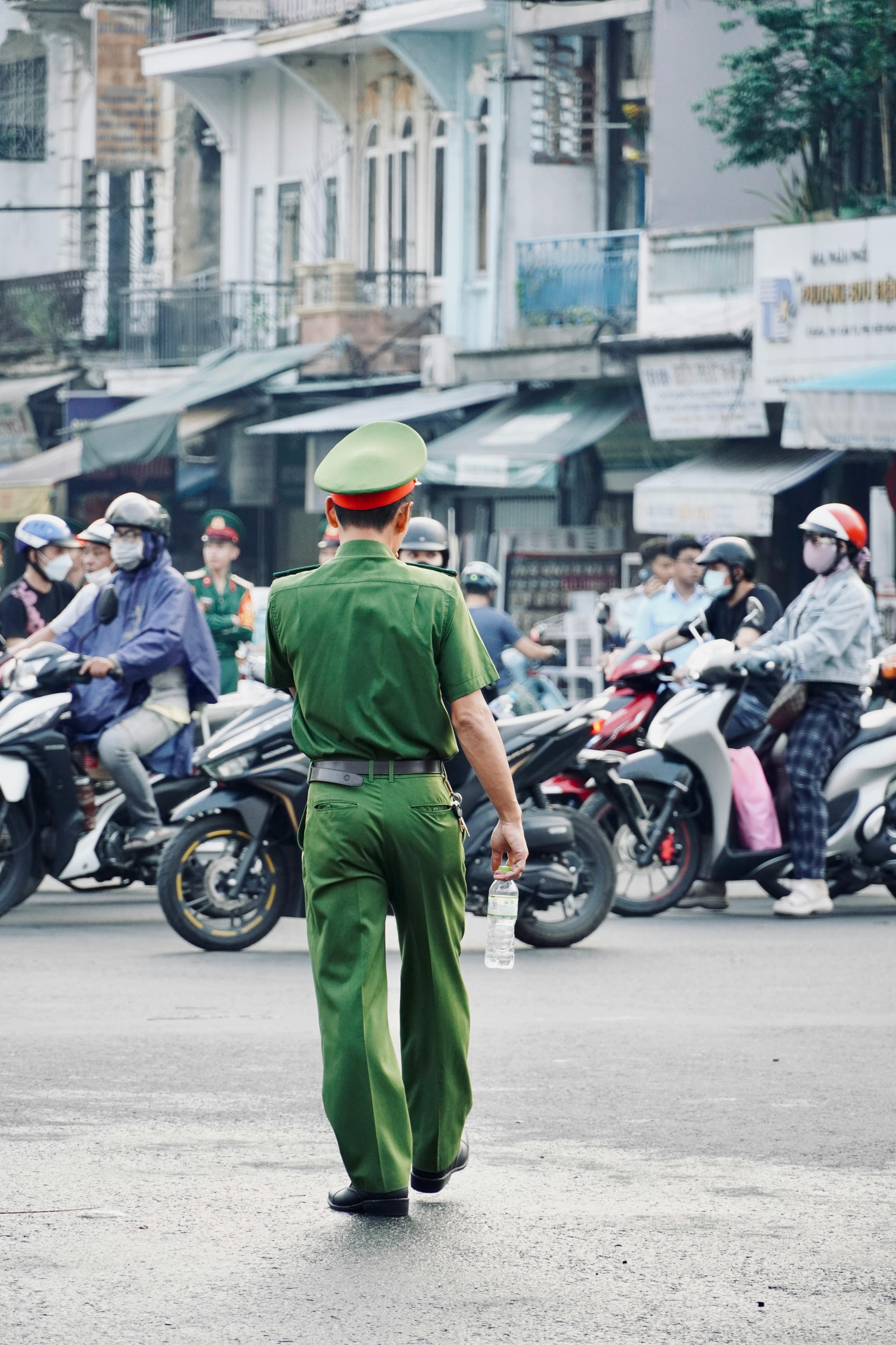 Urban Traffic with Police Officer Monitoring · Free Stock Photo
