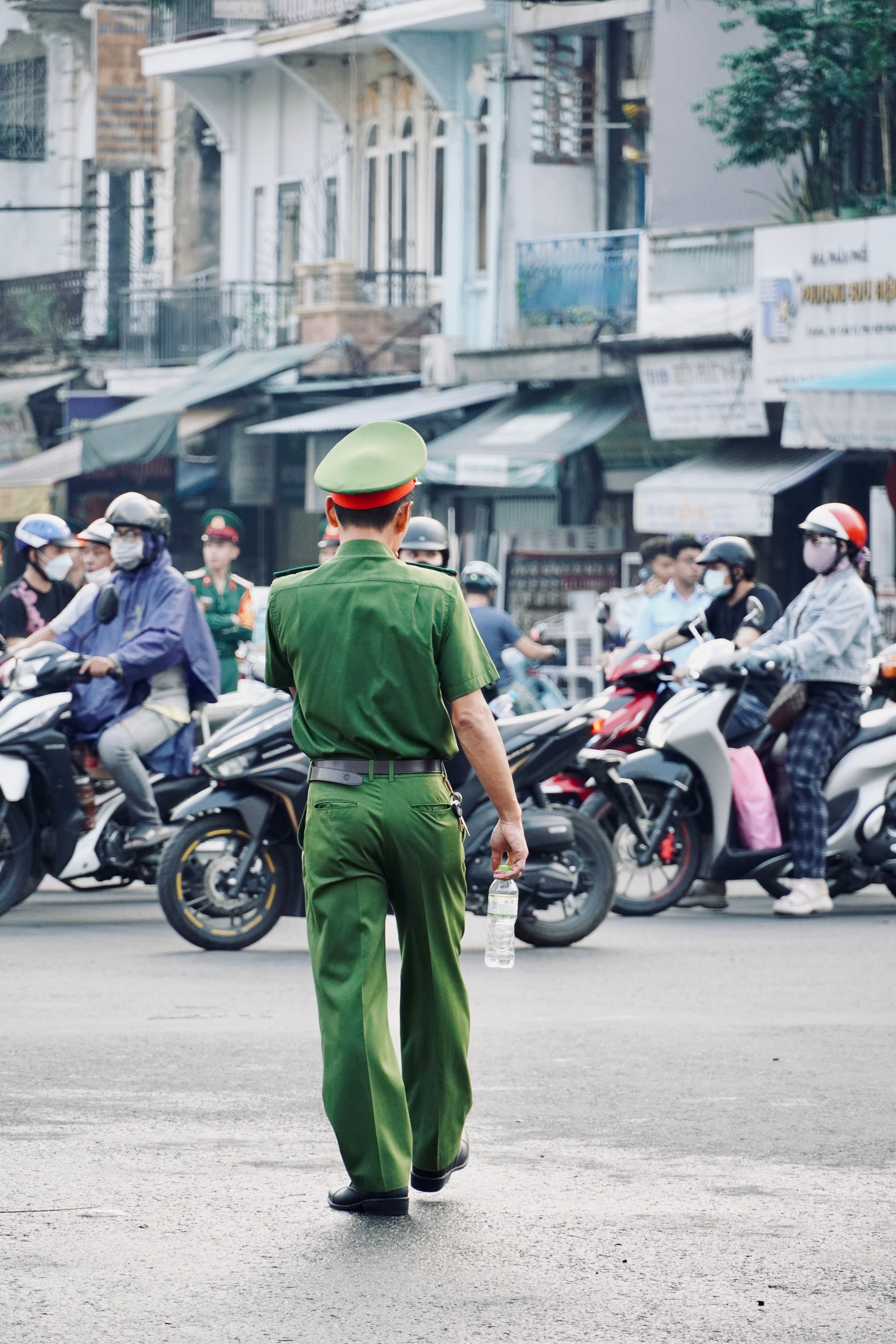 Urban Traffic with Police Officer Monitoring · Free Stock Photo