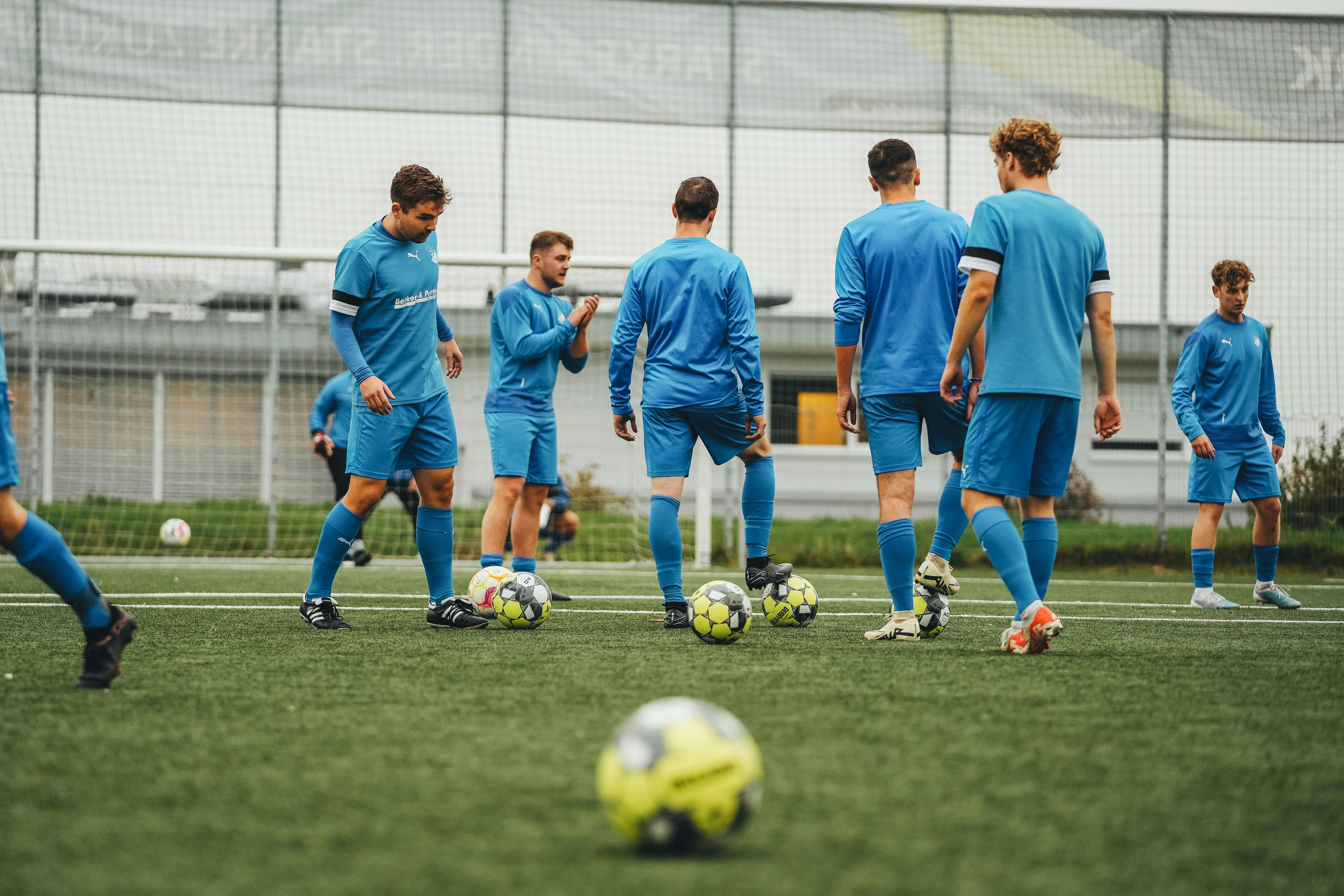 Soccer Team Training on Outdoor Field · Free Stock Photo