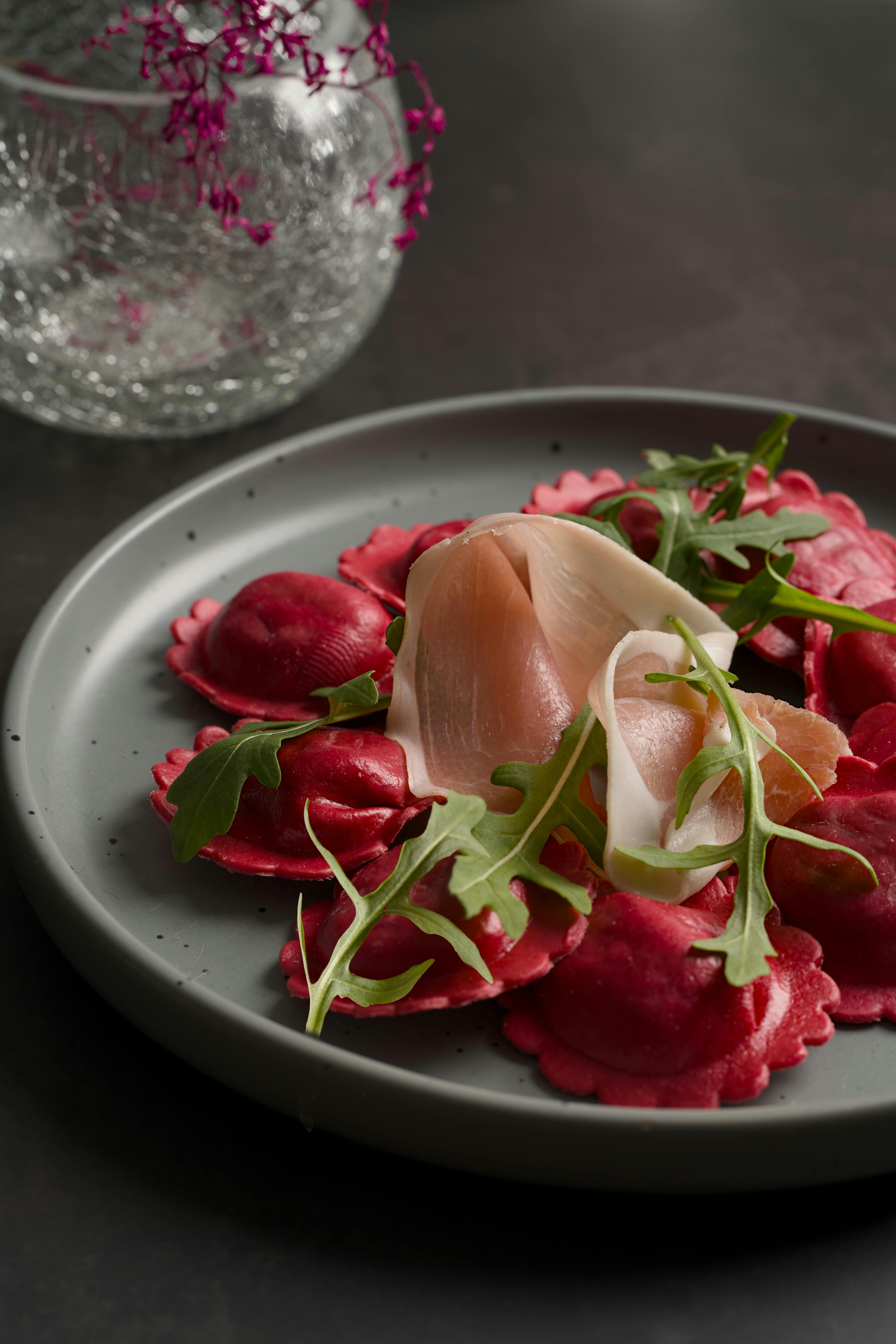 Beet Ravioli with Prosciutto and Arugula on Plate · Free Stock Photo