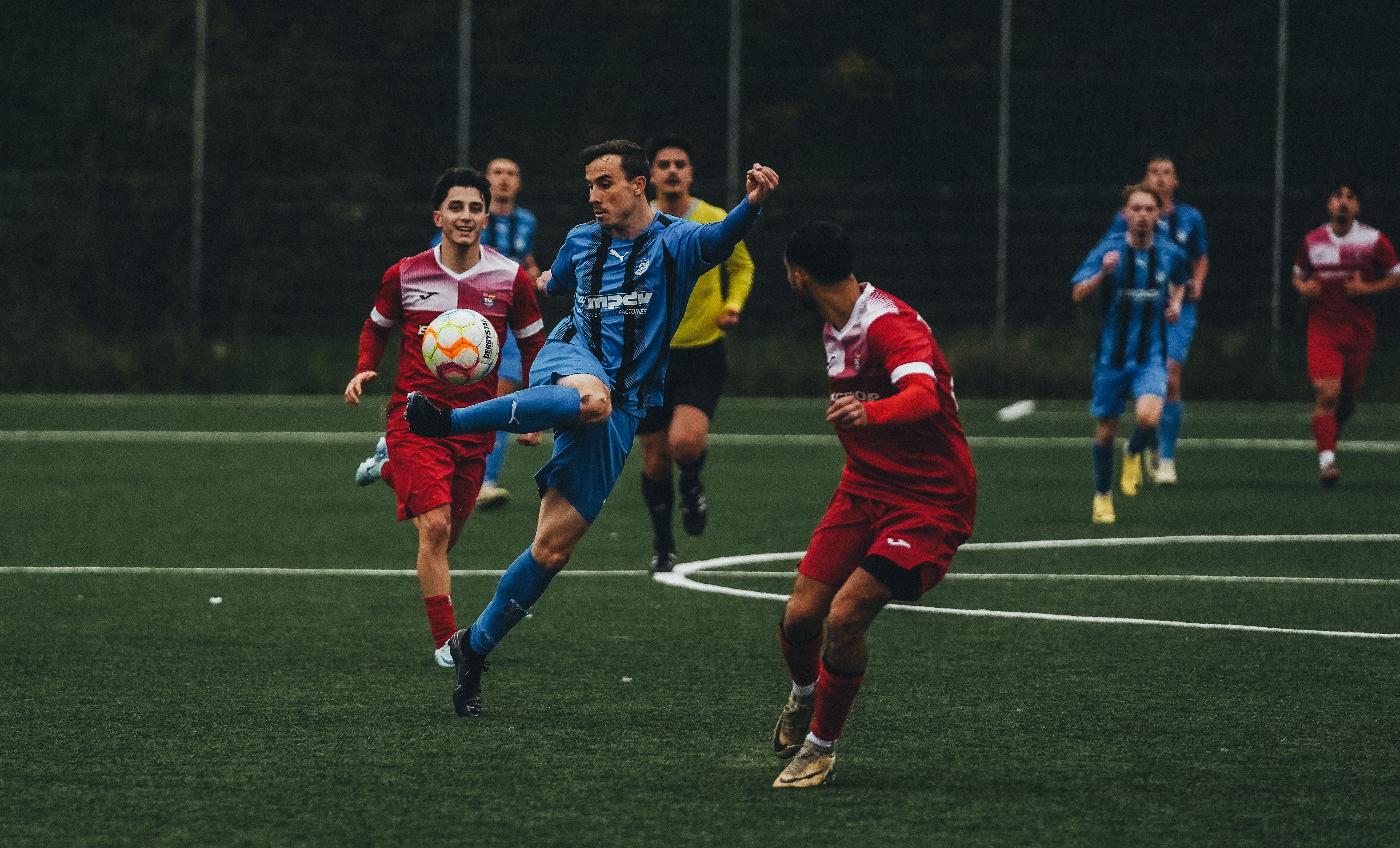 Intense Football Match on Green Field · Free Stock Photo