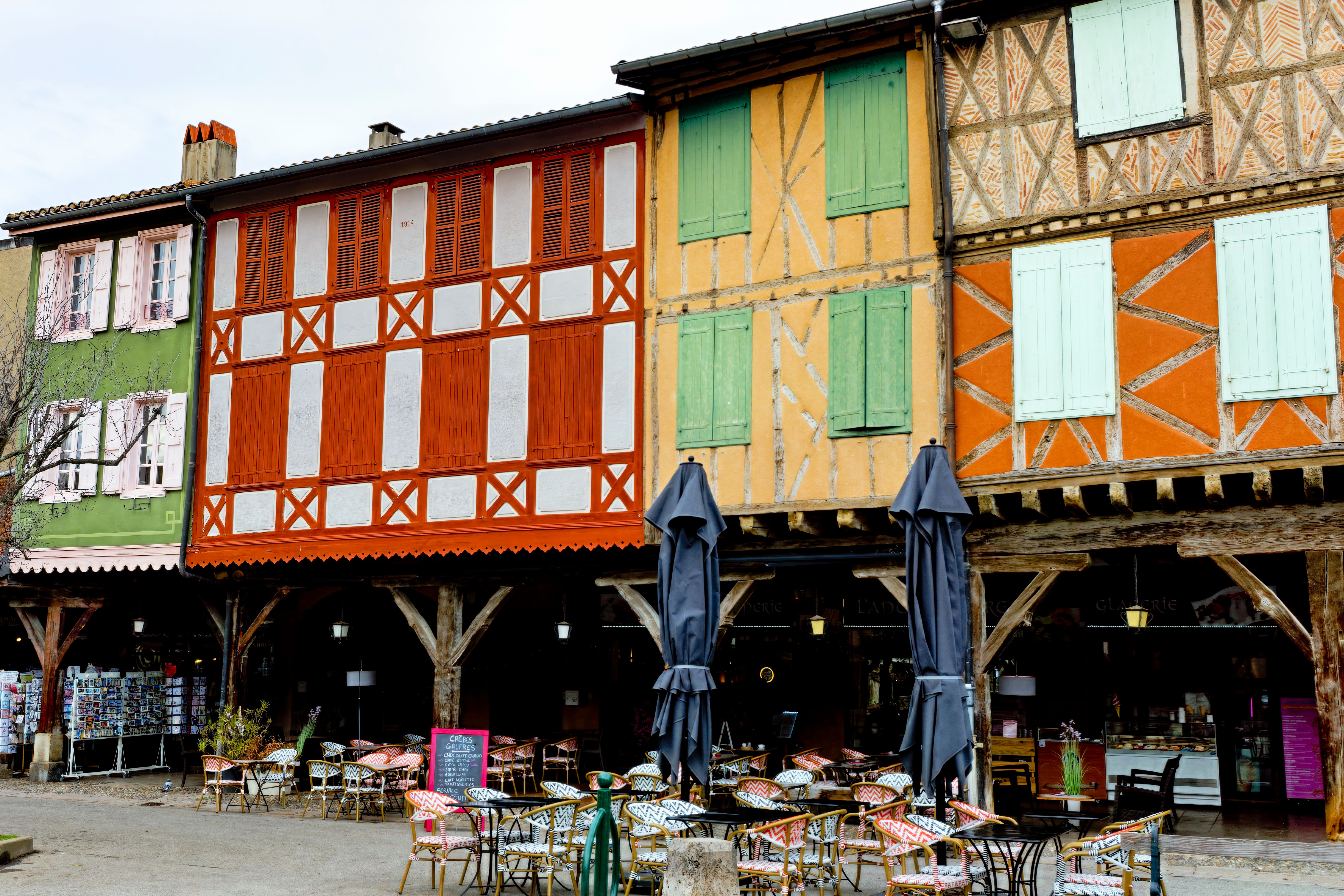 Colorful Half-Timbered Buildings in Mirepoix Square · Free Stock Photo