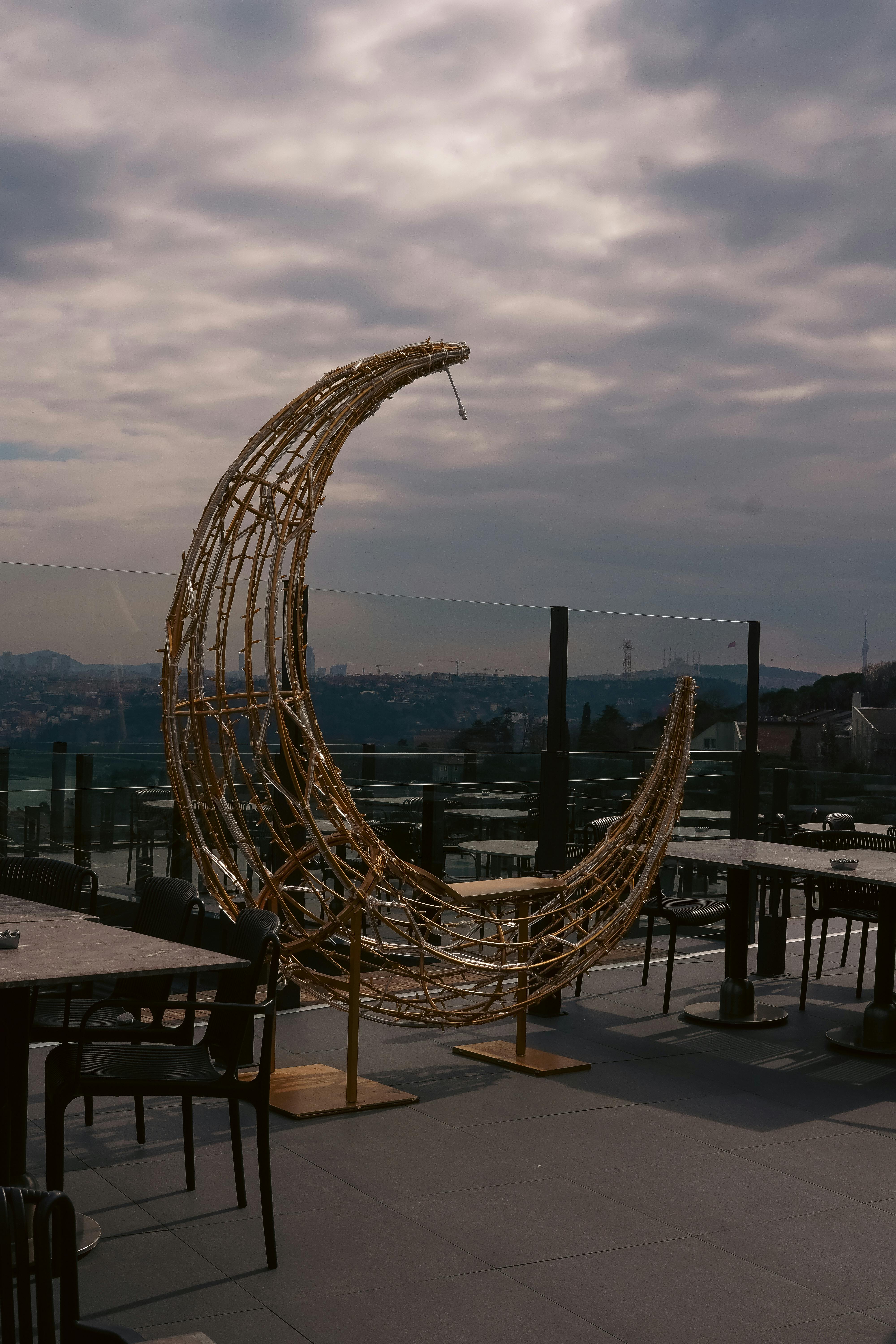 Artistic Moon Sculpture on Rooftop Terrace · Free Stock Photo