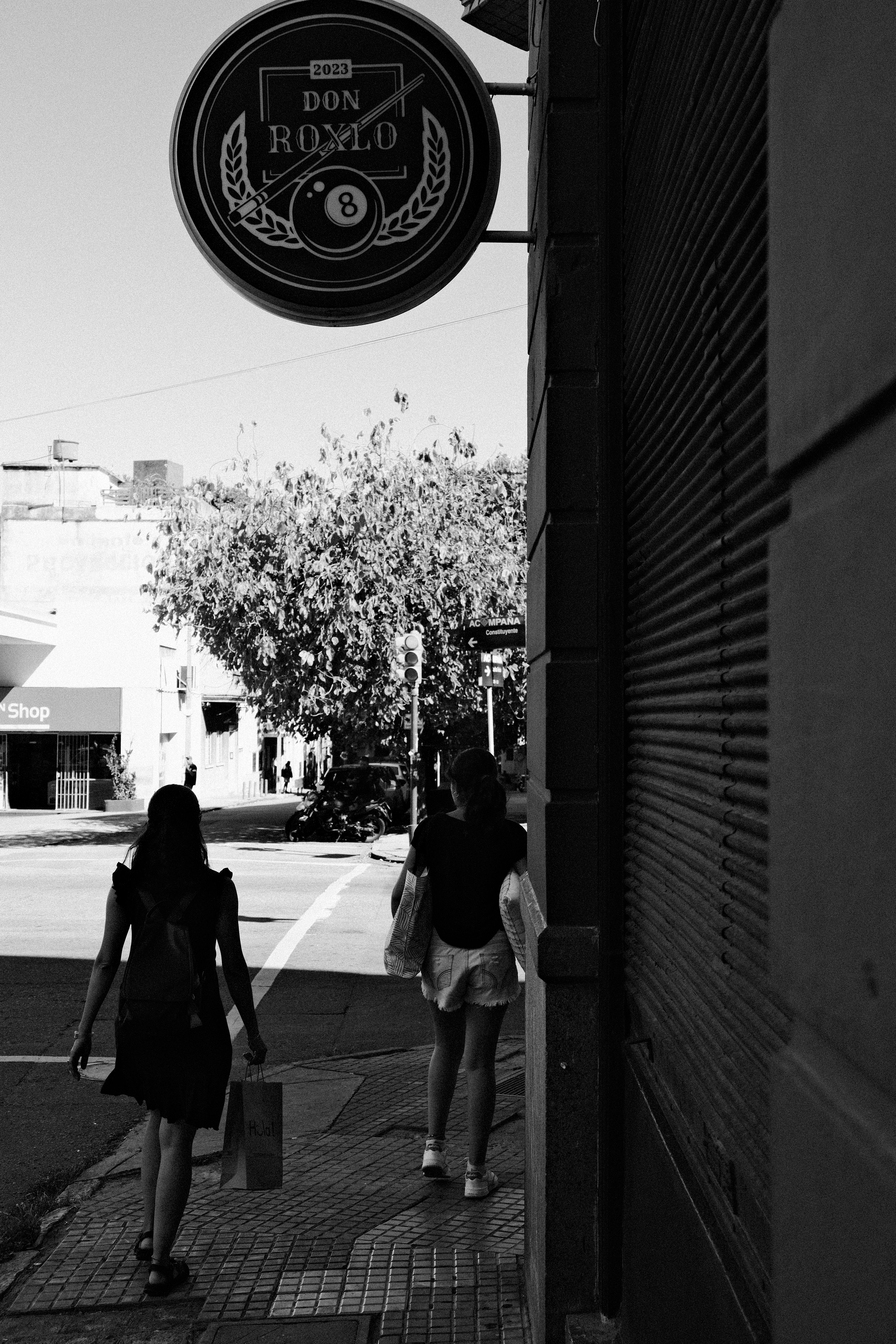 Urban Street Scene with Two Women Walking · Free Stock Photo