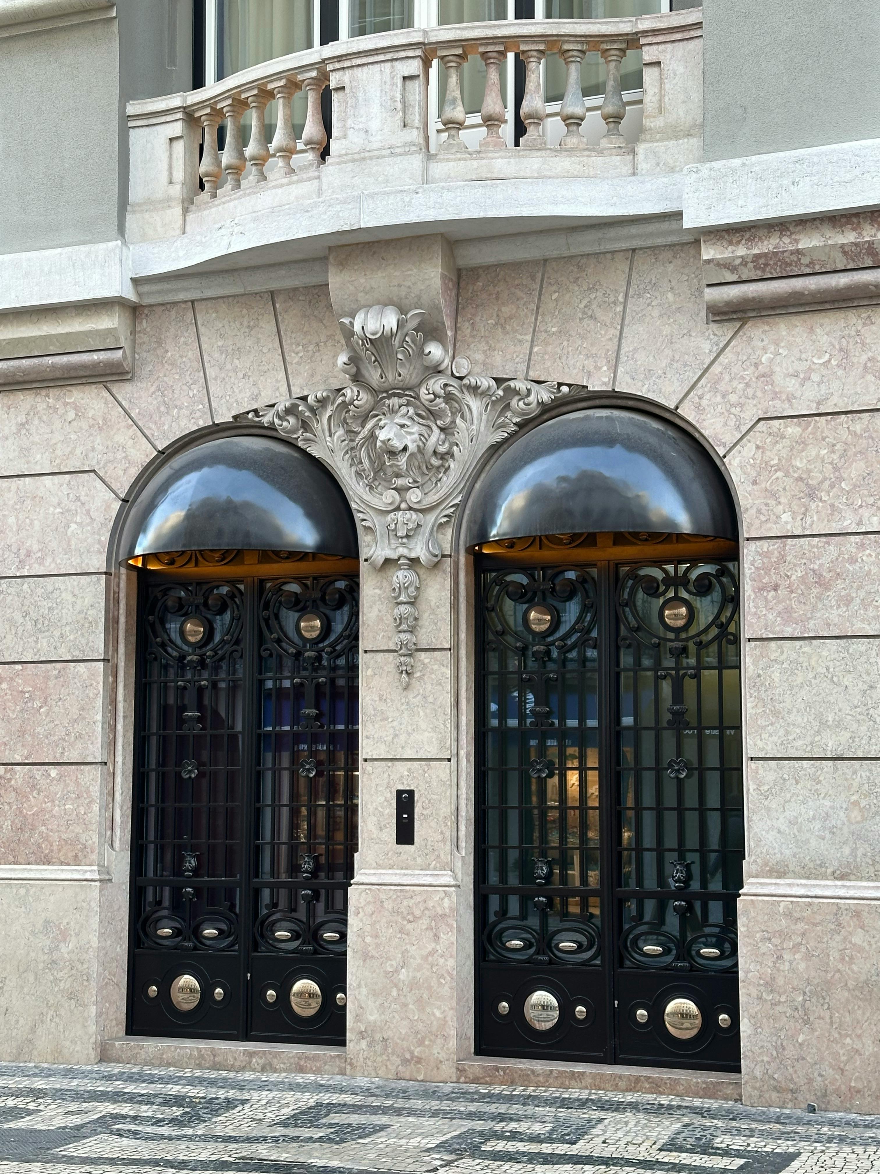 Ornate Iron Doors on Lisbon Building Exterior · Free Stock Photo