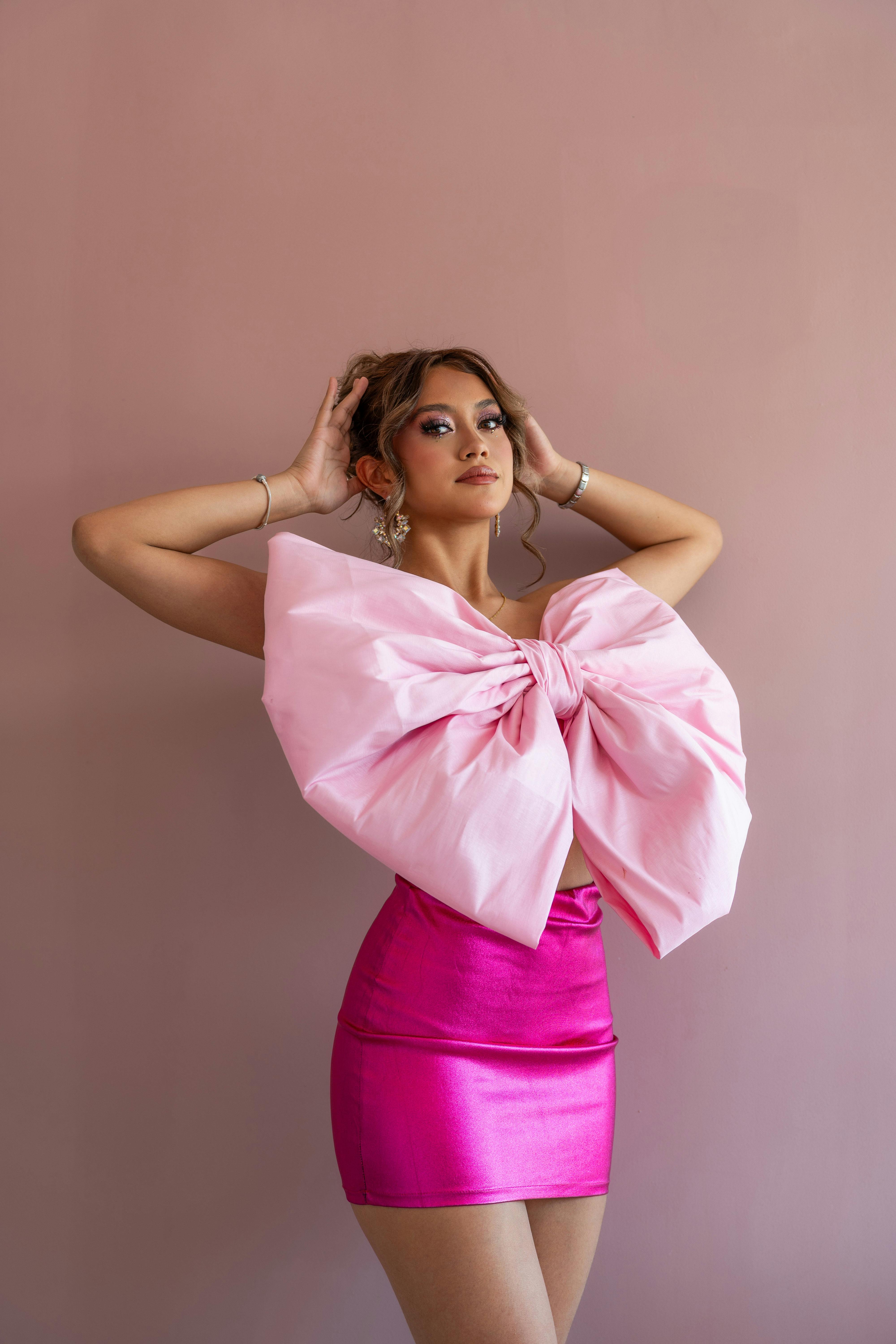 Fashionable Woman in Pink Bow Dress · Free Stock Photo