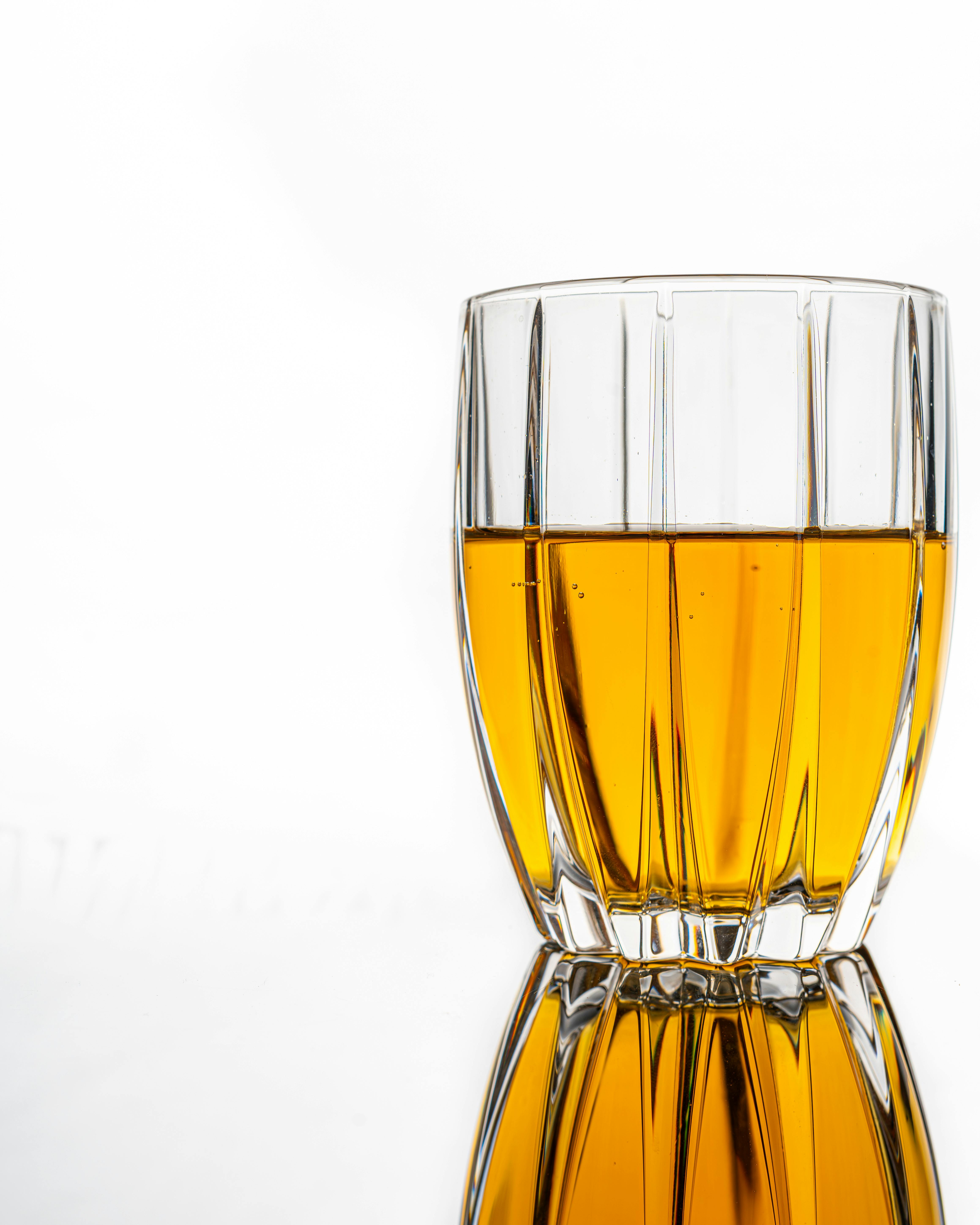 Crystal Glass with Whiskey on White Background · Free Stock Photo