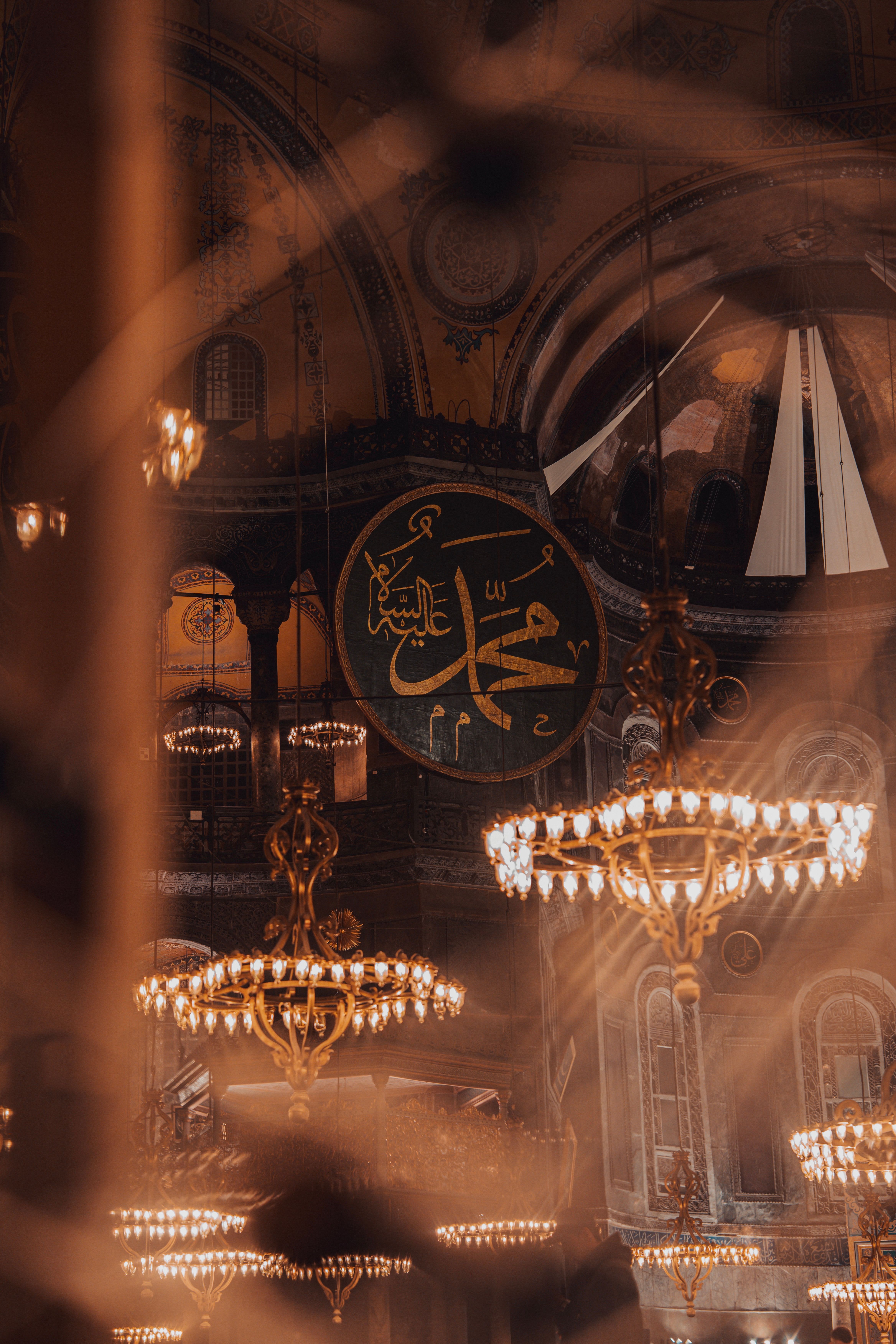 Illuminated Arabic Calligraphy in Historic Interior · Free Stock Photo