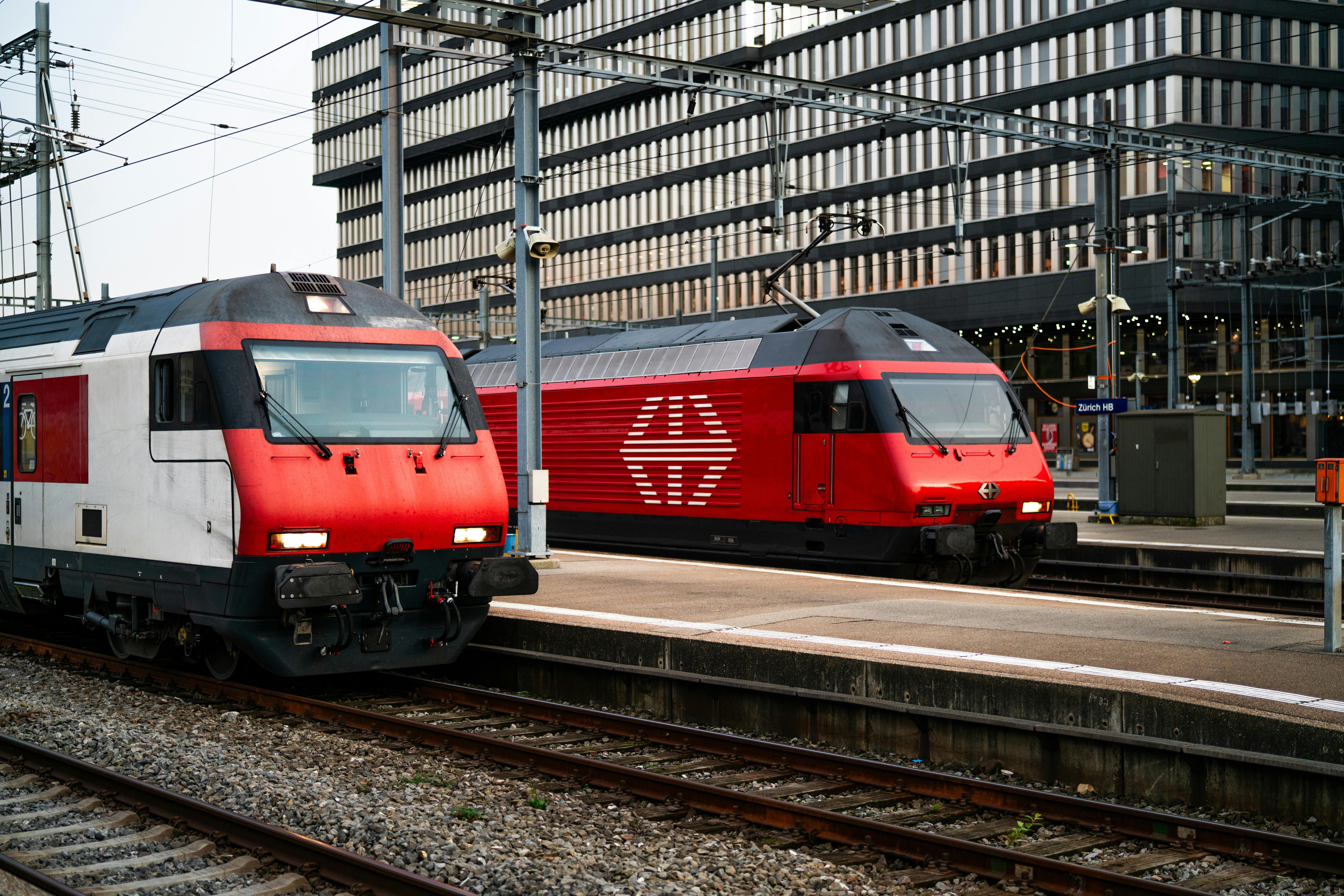 Red trains at a busy Zurich train station · Free Stock Photo