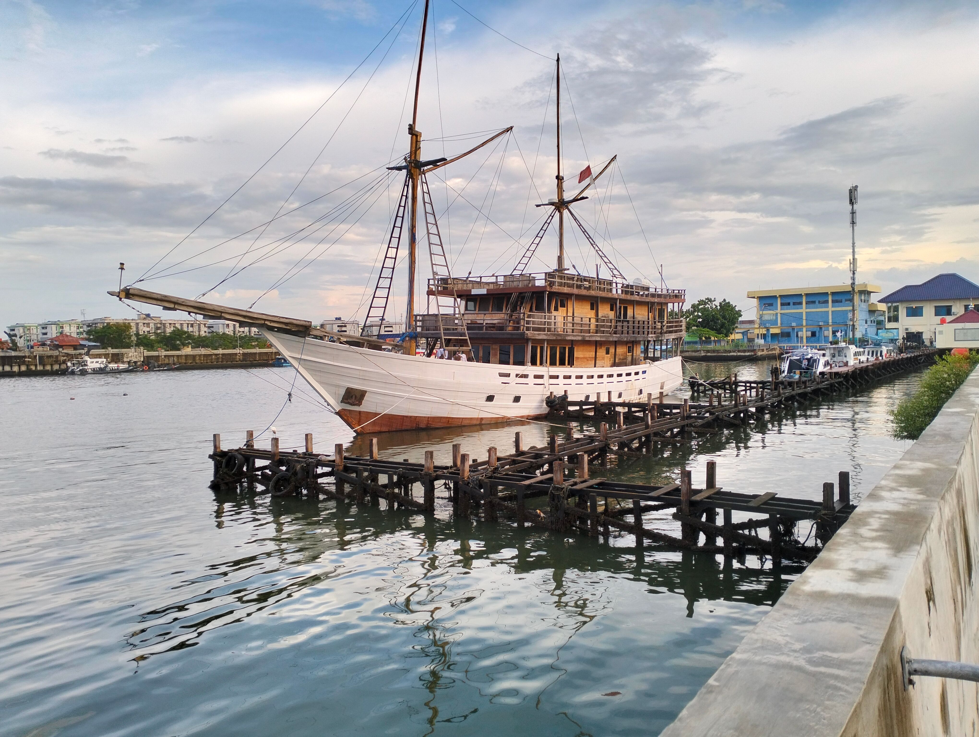 Traditional Wooden Ship Docked in Jakarta Harbor · Free Stock Photo