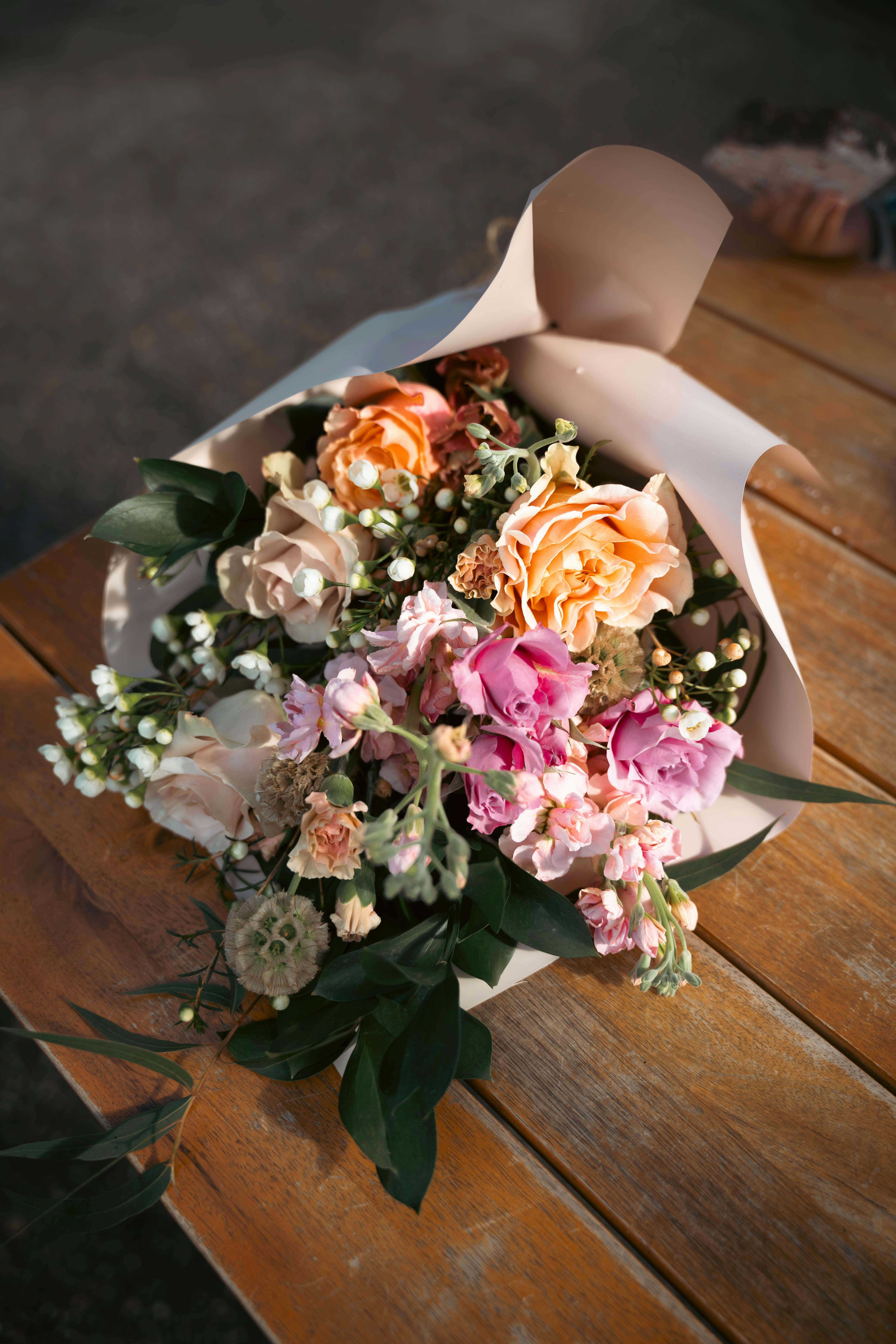 Elegant Bouquet of Roses and Wildflowers Outdoors · Free Stock Photo