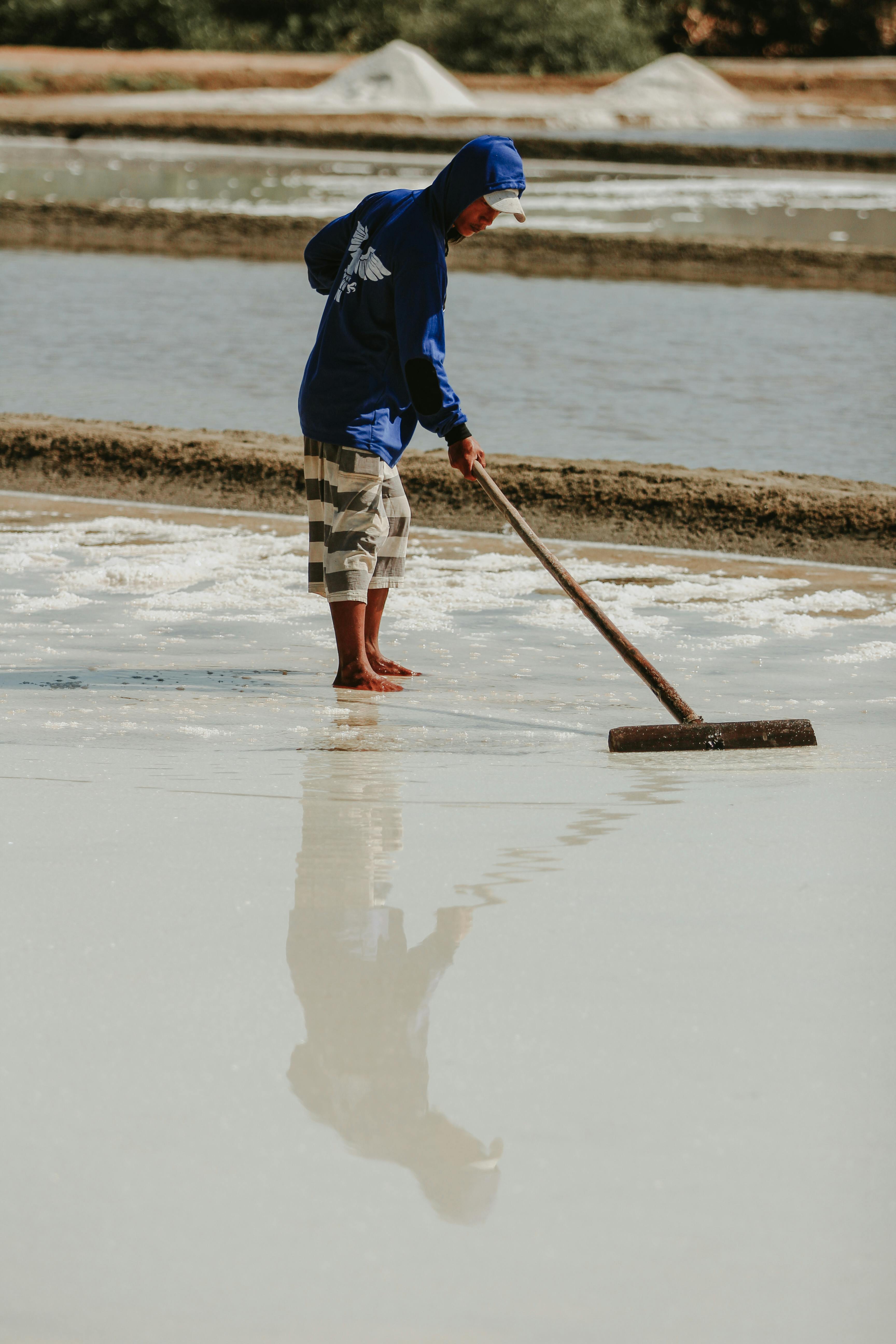 Salt Farmer Working at Salt Farm in East Java · Free Stock Photo