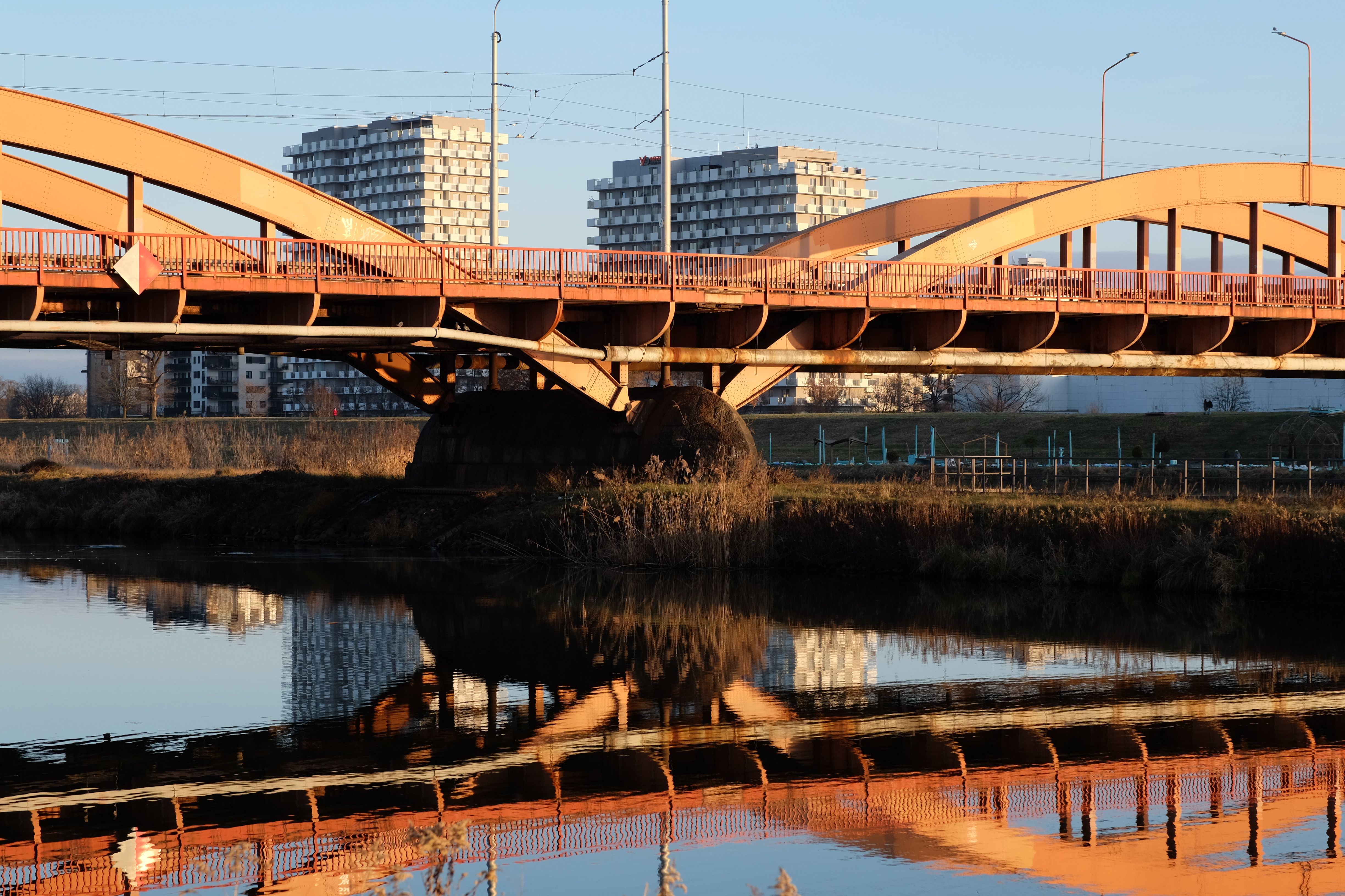 Scenic Urban Bridge and Waterfront Reflection · Free Stock Photo