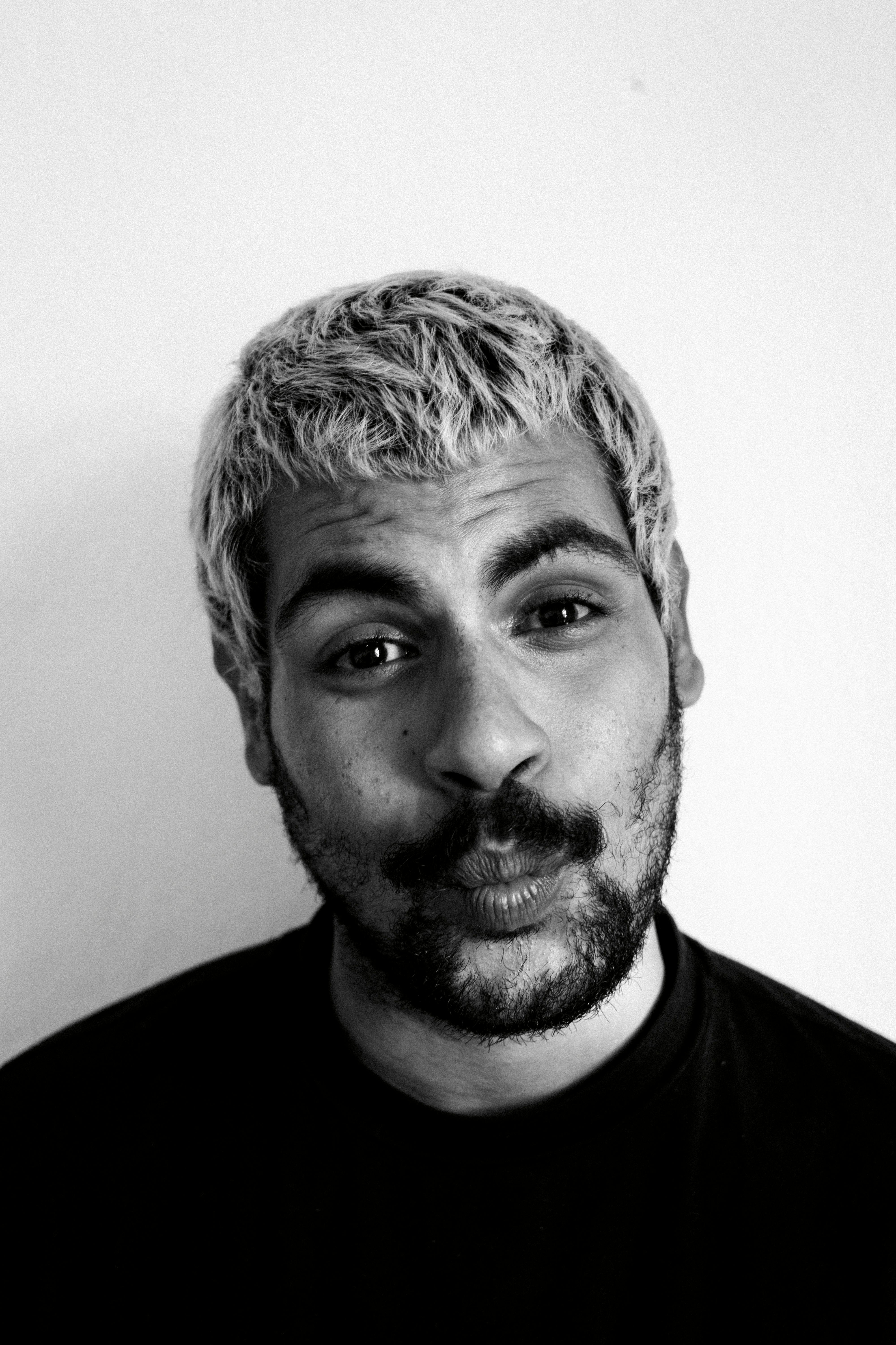 Monochrome Portrait of Man With Pout Expression · Free Stock Photo