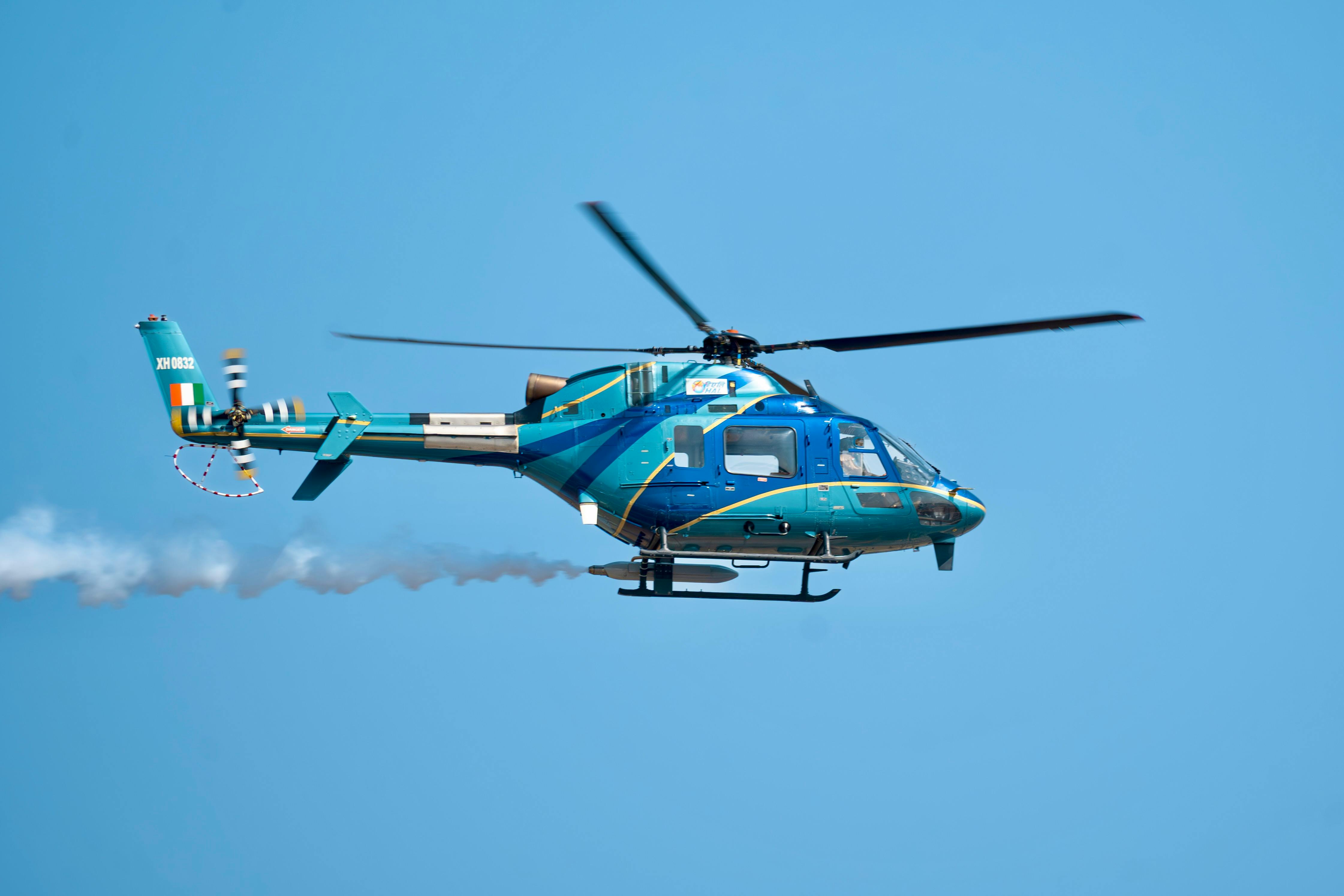 Blue Helicopter Performing at Aero India Show · Free Stock Photo