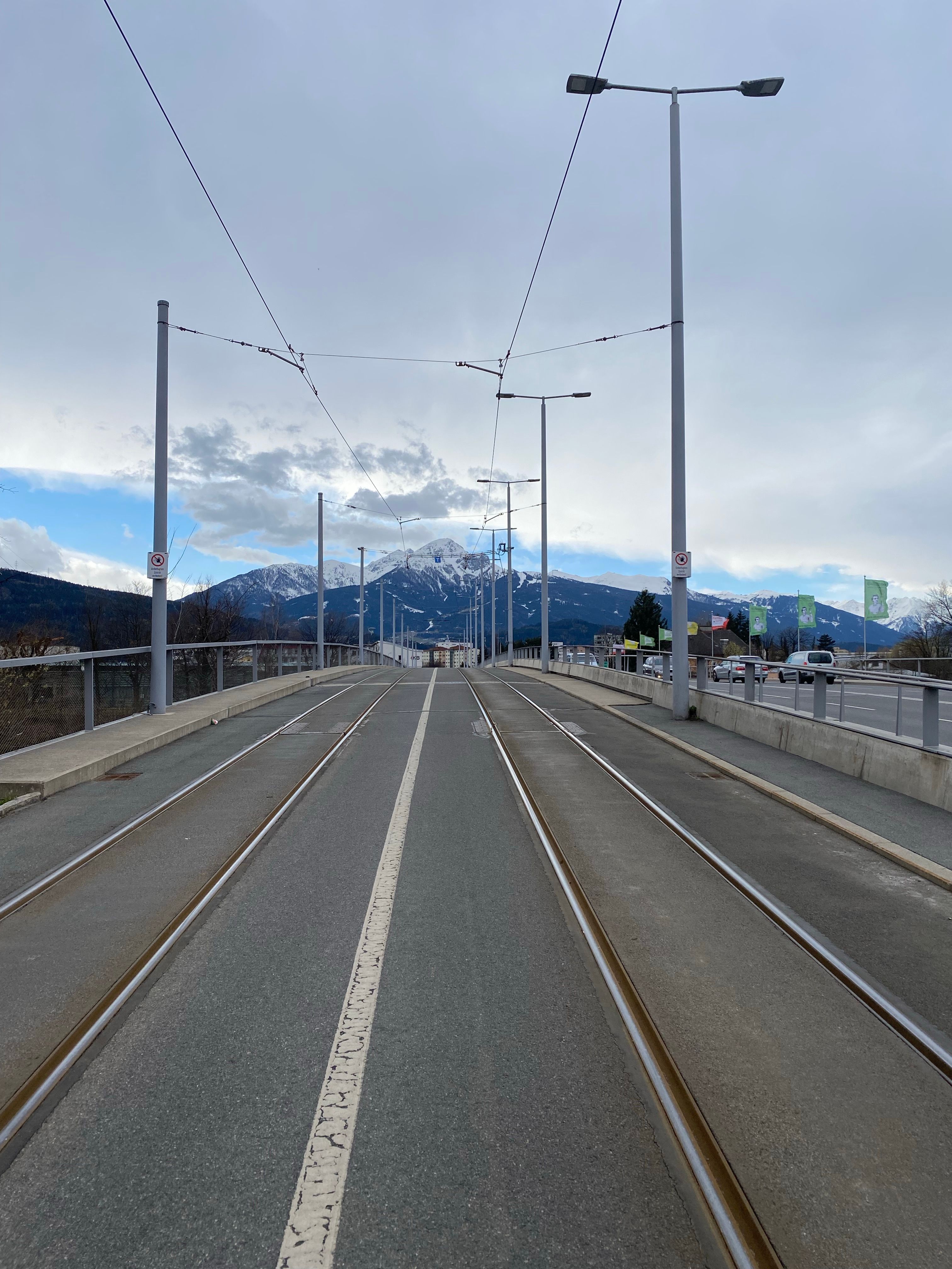 Tram Tracks Leading to Snowy Mountain View · Free Stock Photo
