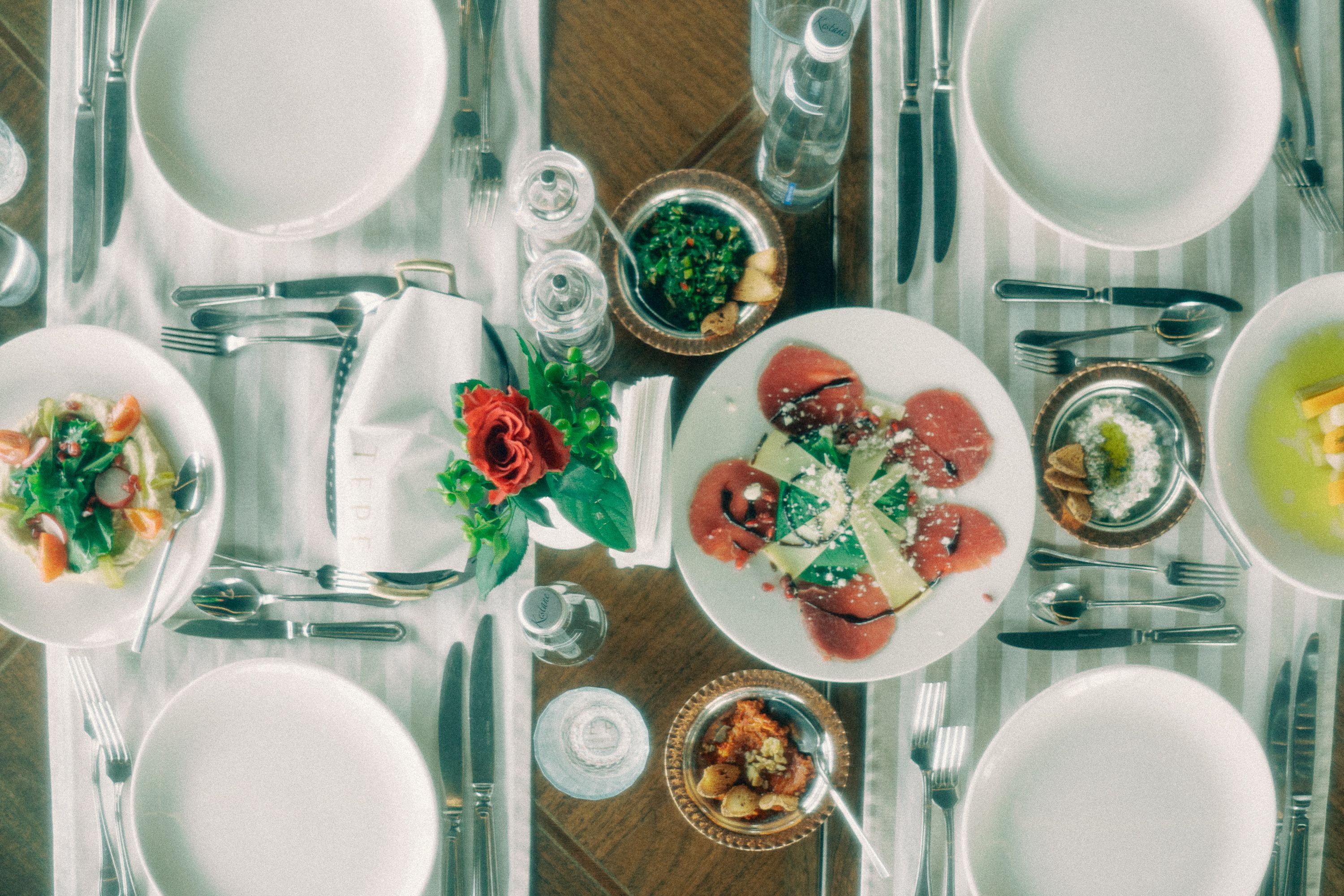 Elegant Table Setting with Diverse Gourmet Dishes · Free Stock Photo