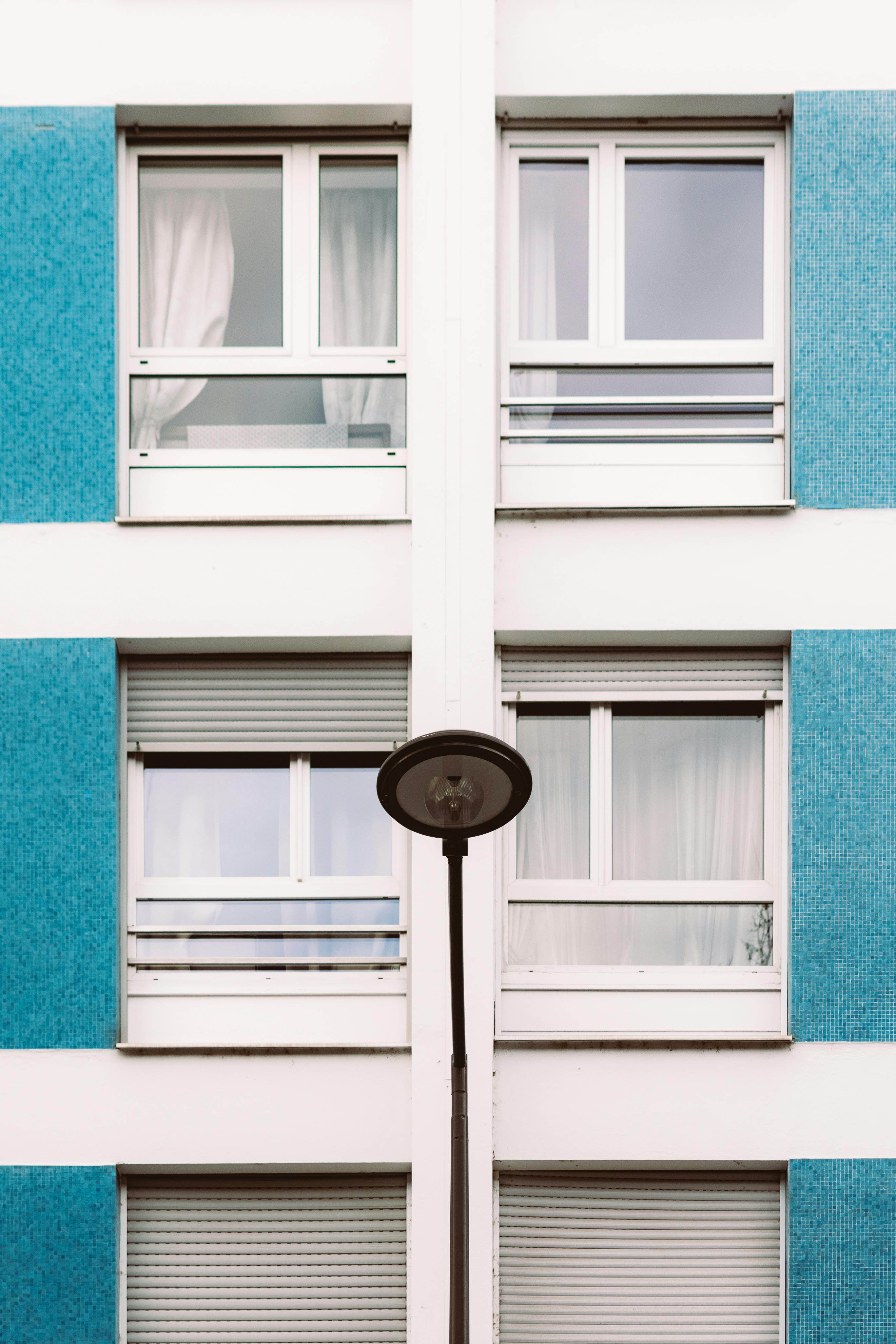 Blue and White Building Facade with Streetlamp · Free Stock Photo