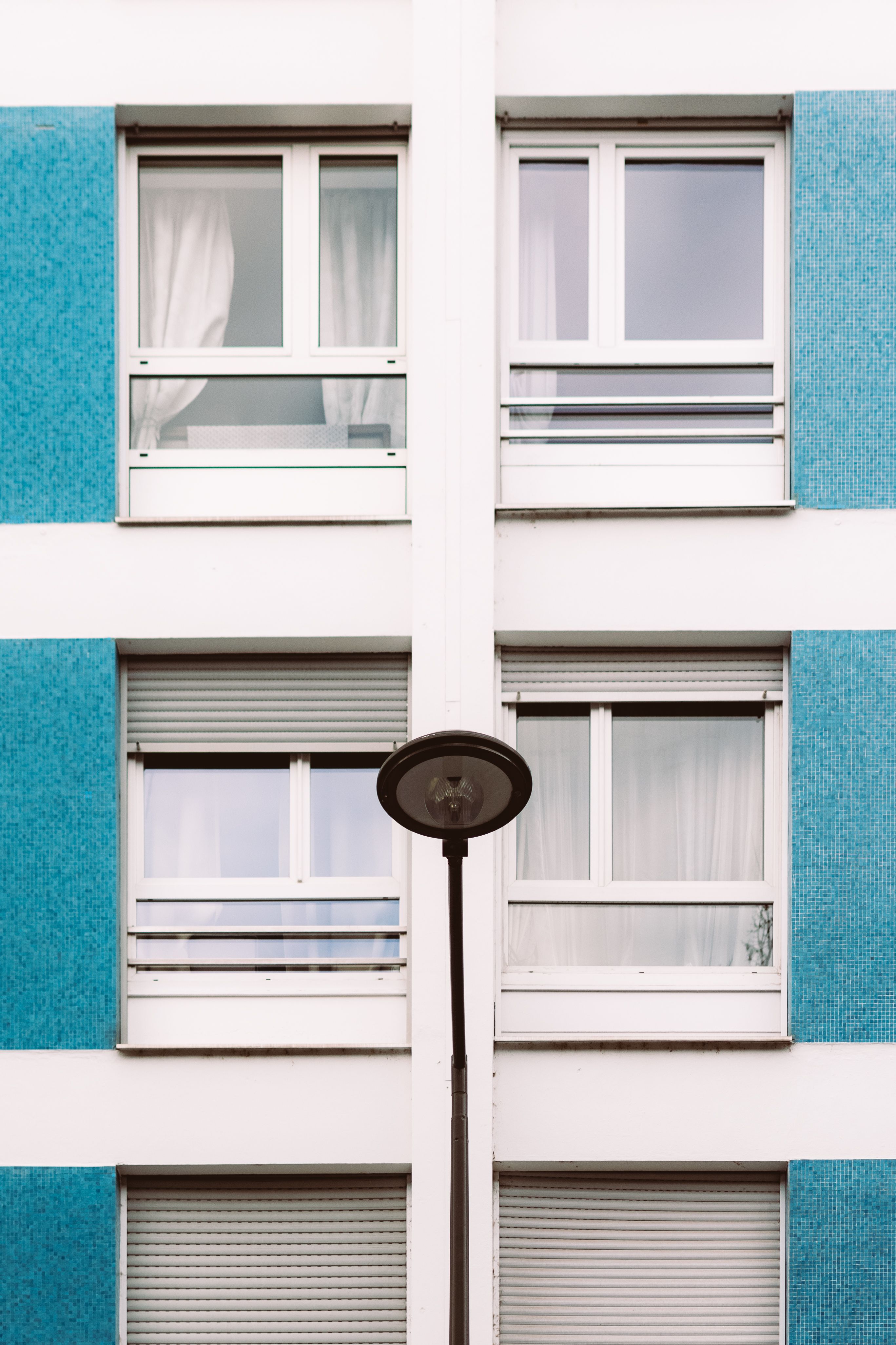Blue and White Building Facade with Streetlamp · Free Stock Photo